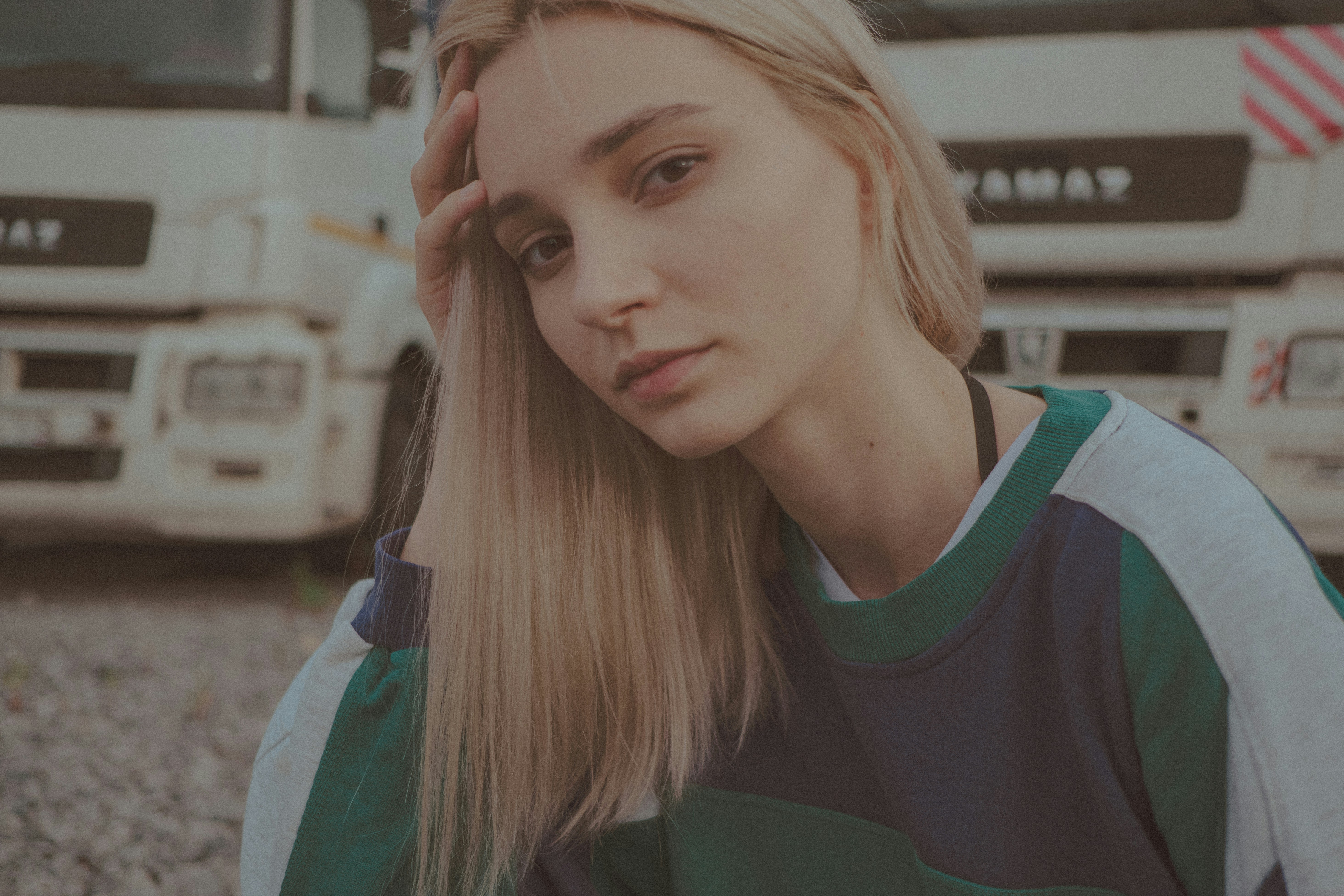 Portrait in a Truck Yard: Soft Focus, Quiet Gaze