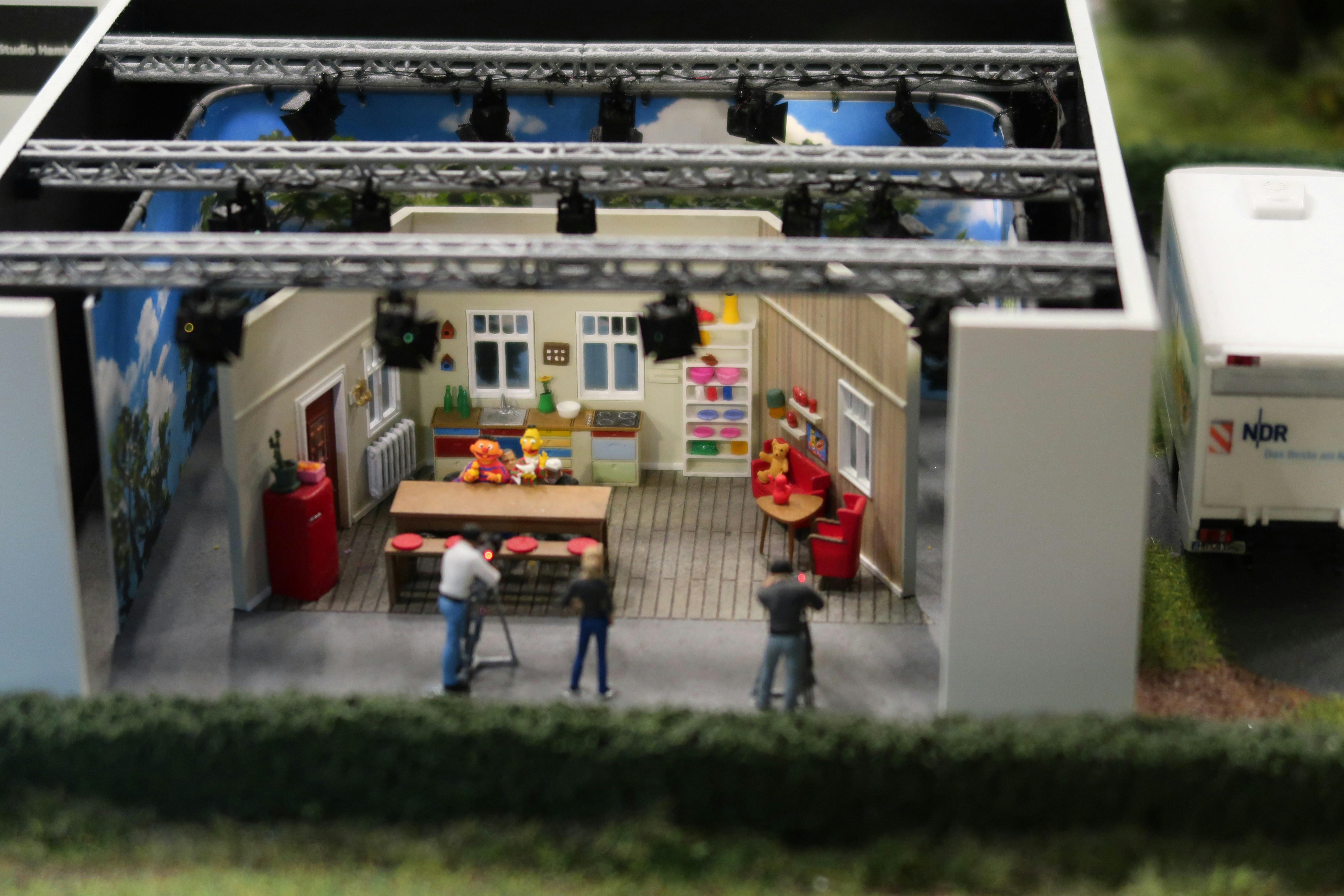 Miniature Studio: A Cozy Workshop Scene Under Stage Lights