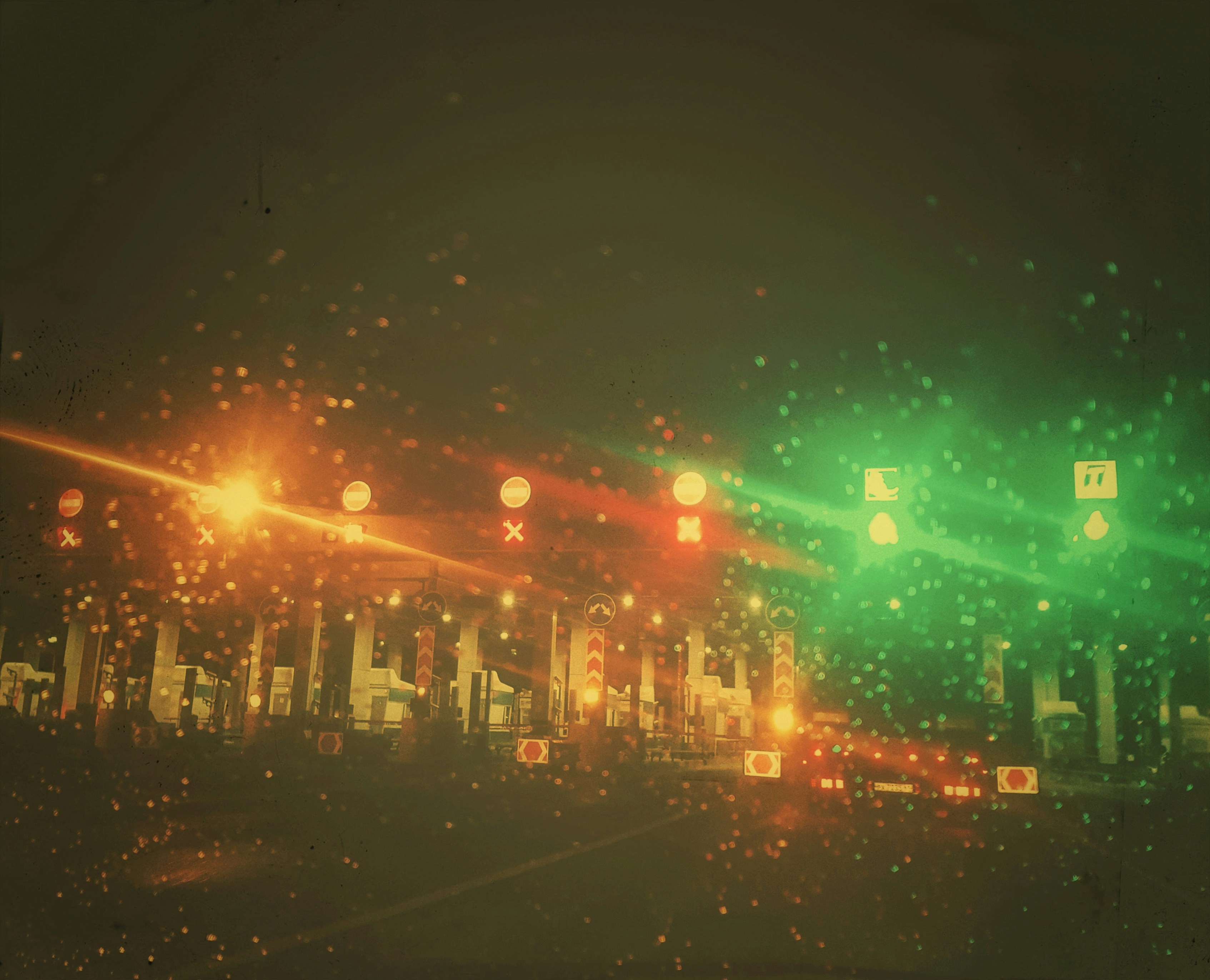 Neon City Bokeh: Red and Green Sparks Over a Distant Skyline