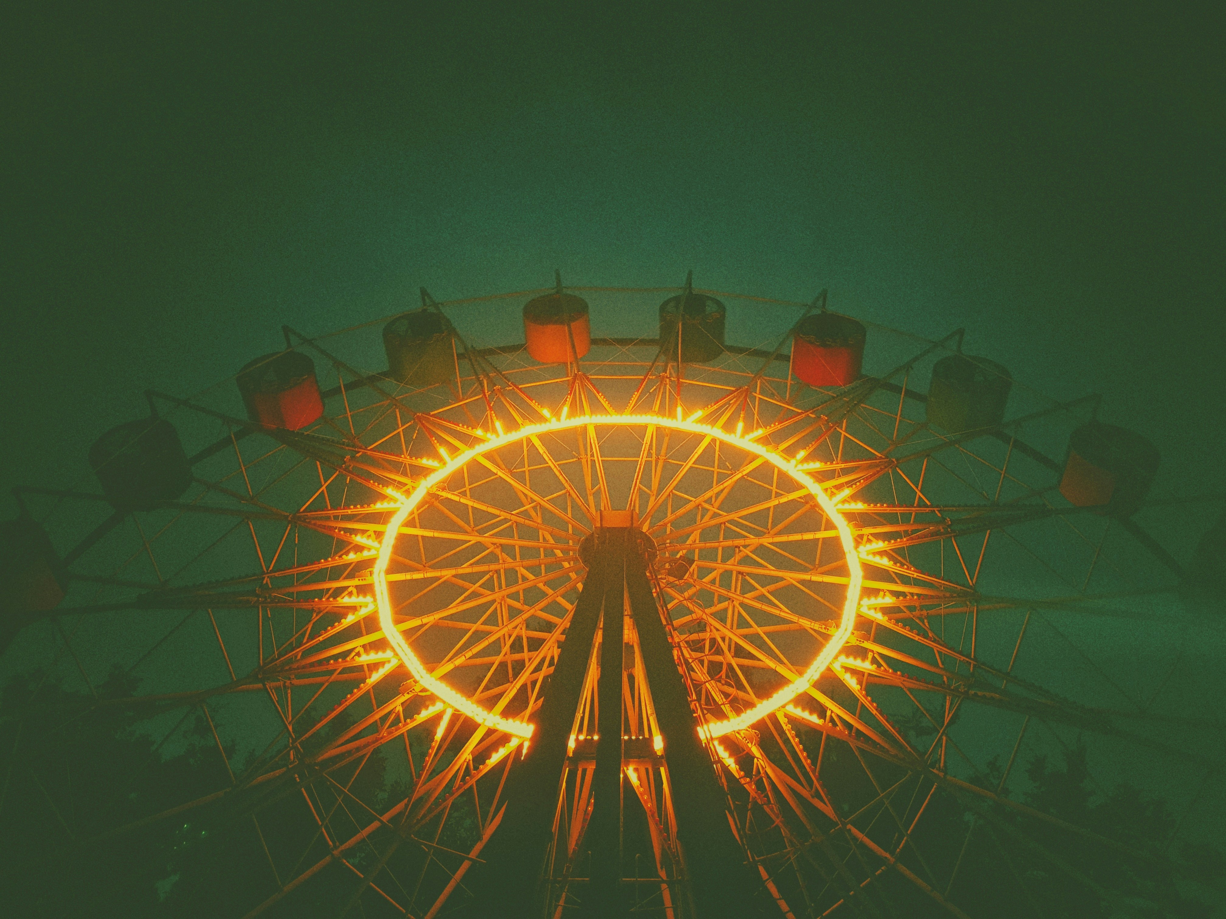 Glowing Wheel: Midnight Ferris Wheel Backlit in Neon Green Night