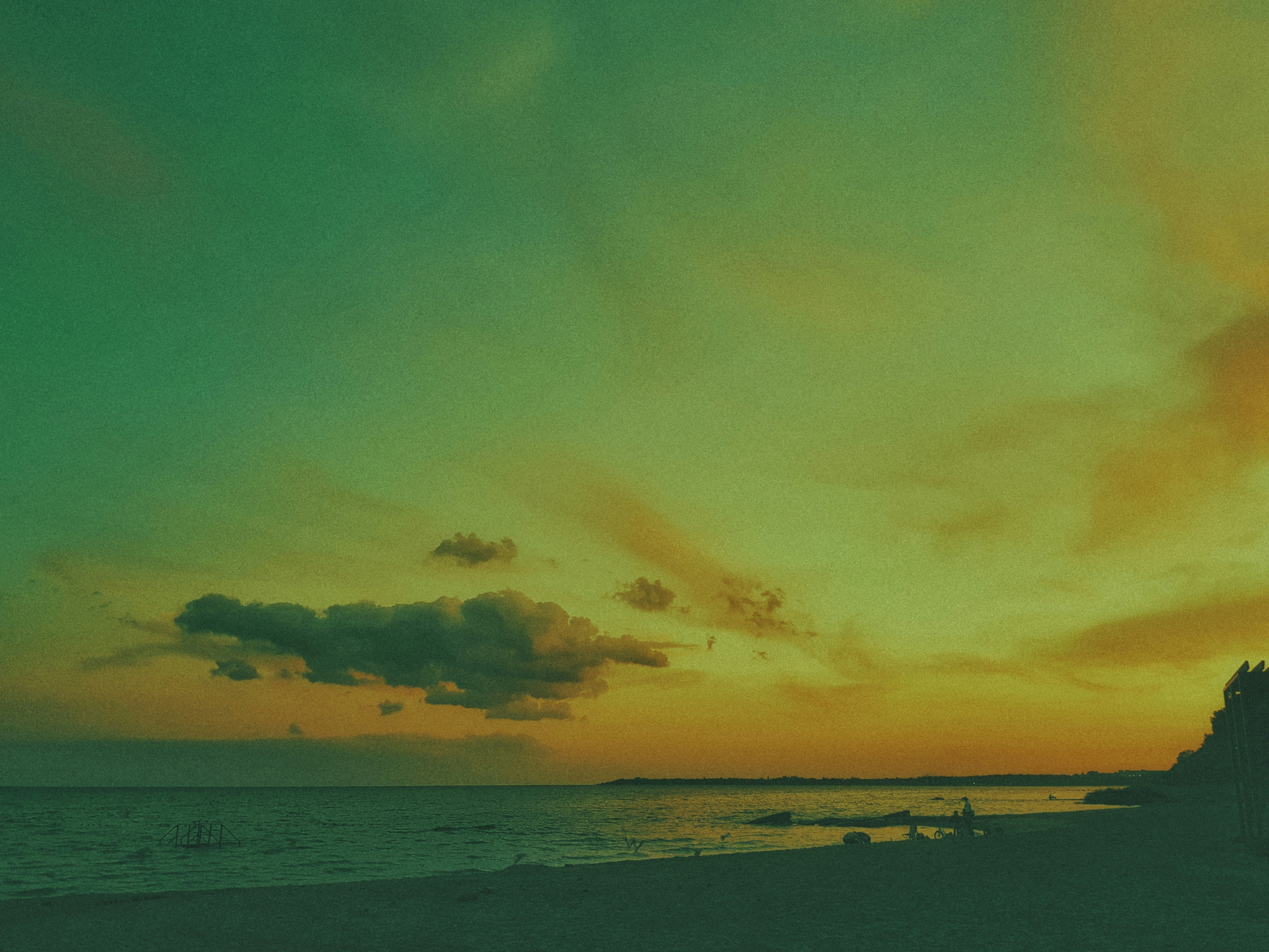 Dusk at the Quiet Shore: Golden Horizon Over Calm Waters