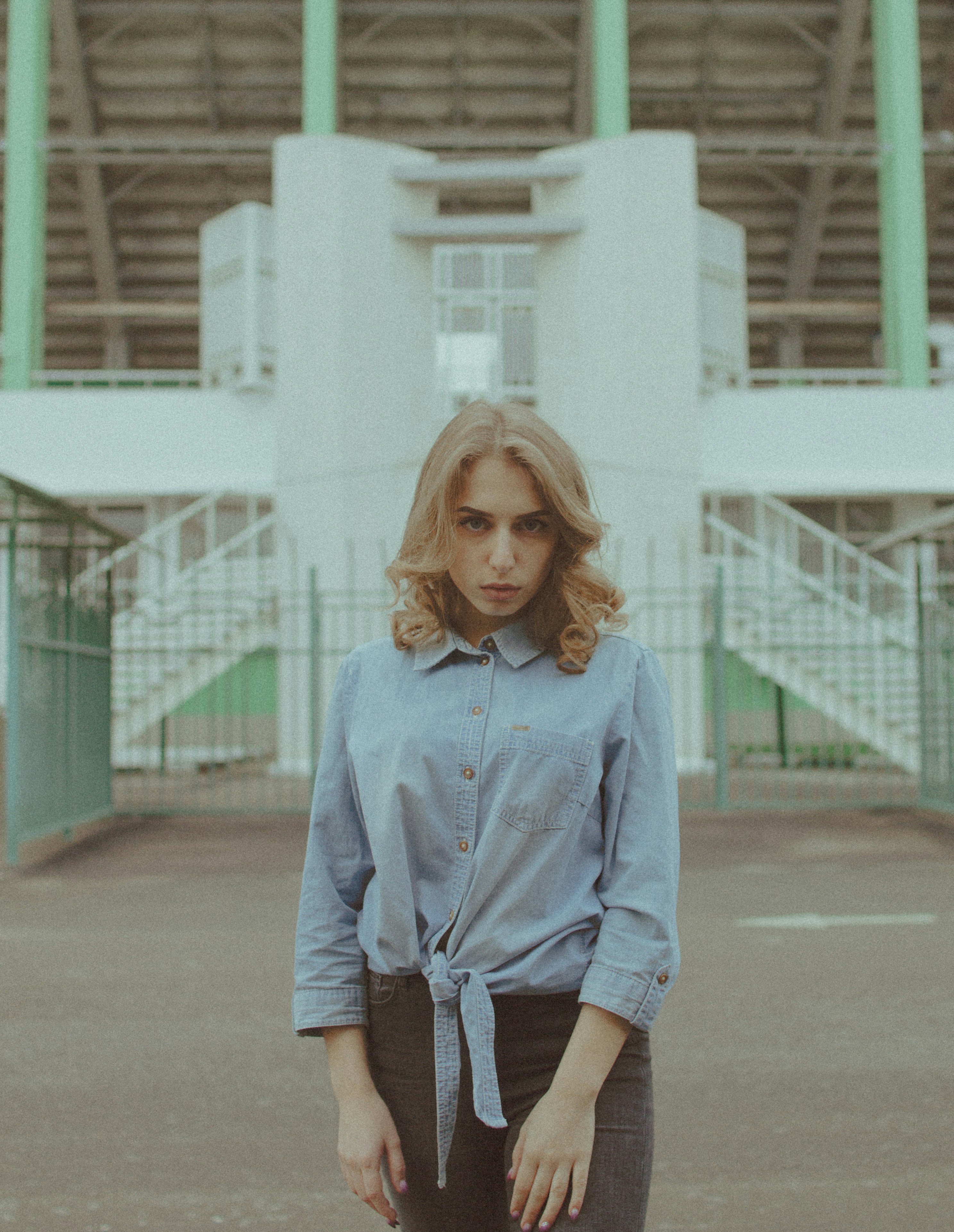 Soft Focus Portrait Under Industrial Archways