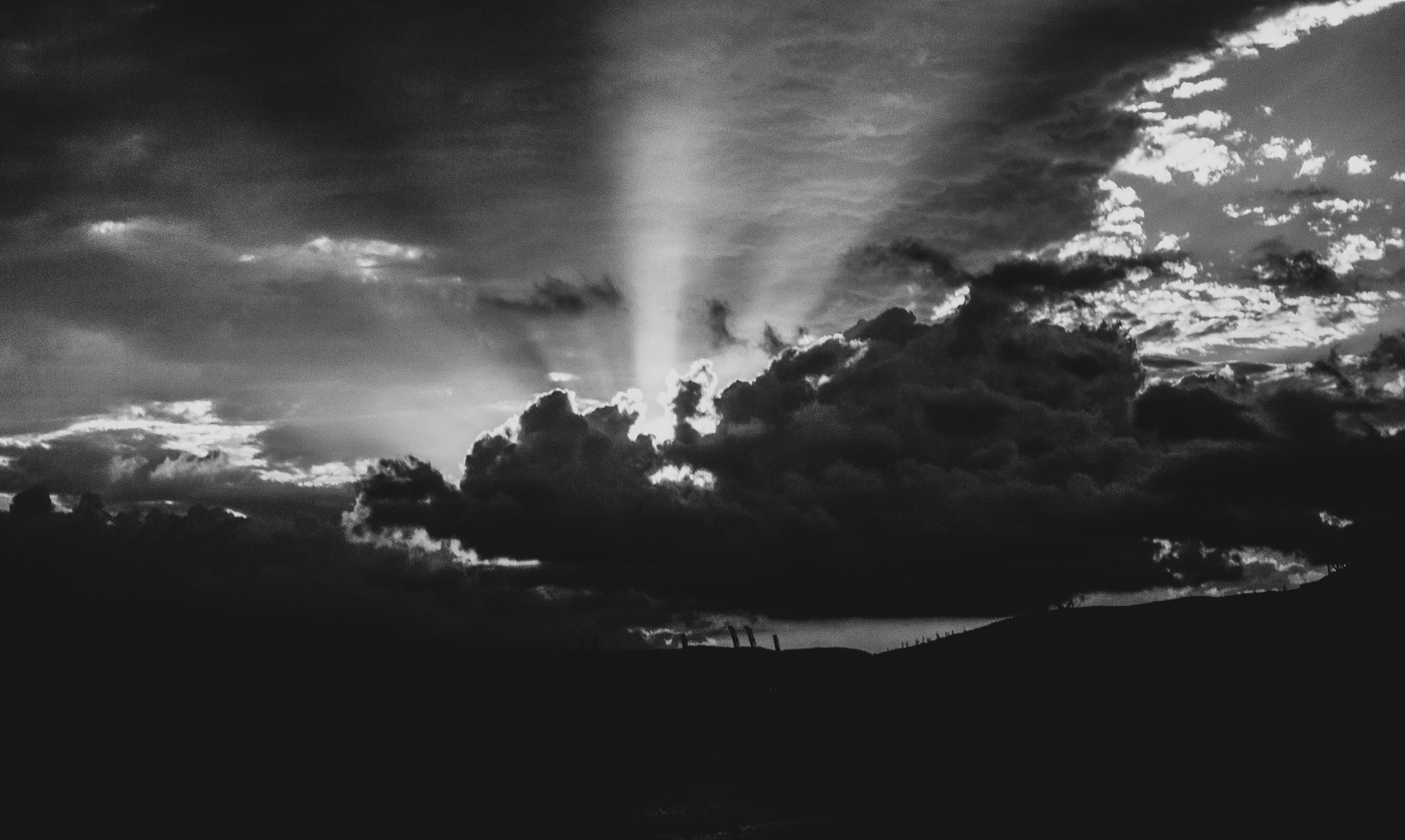 Crepuscular Burst Above a Quiet Horizon