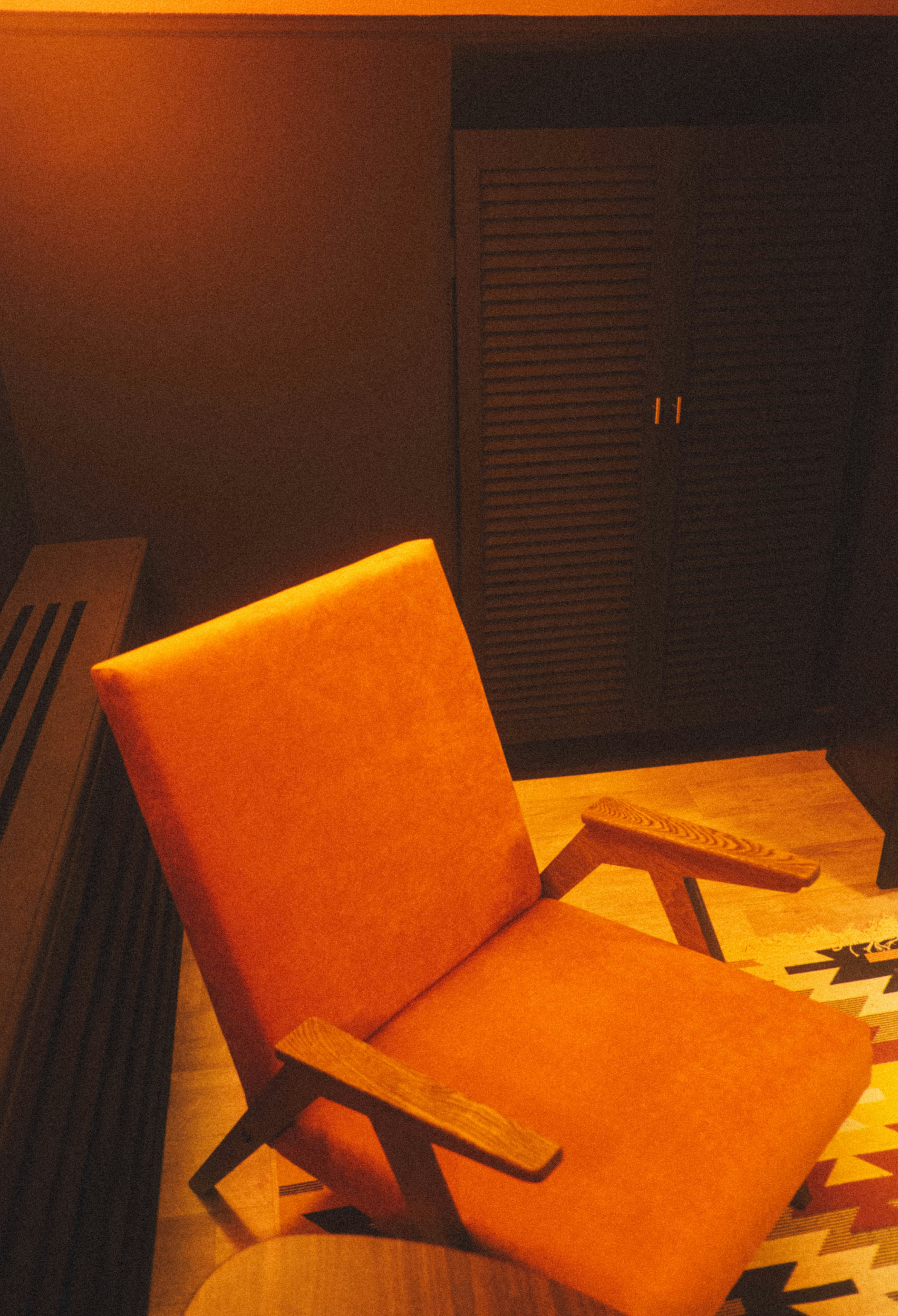 Warm Orange Comfort in a Dim Studio