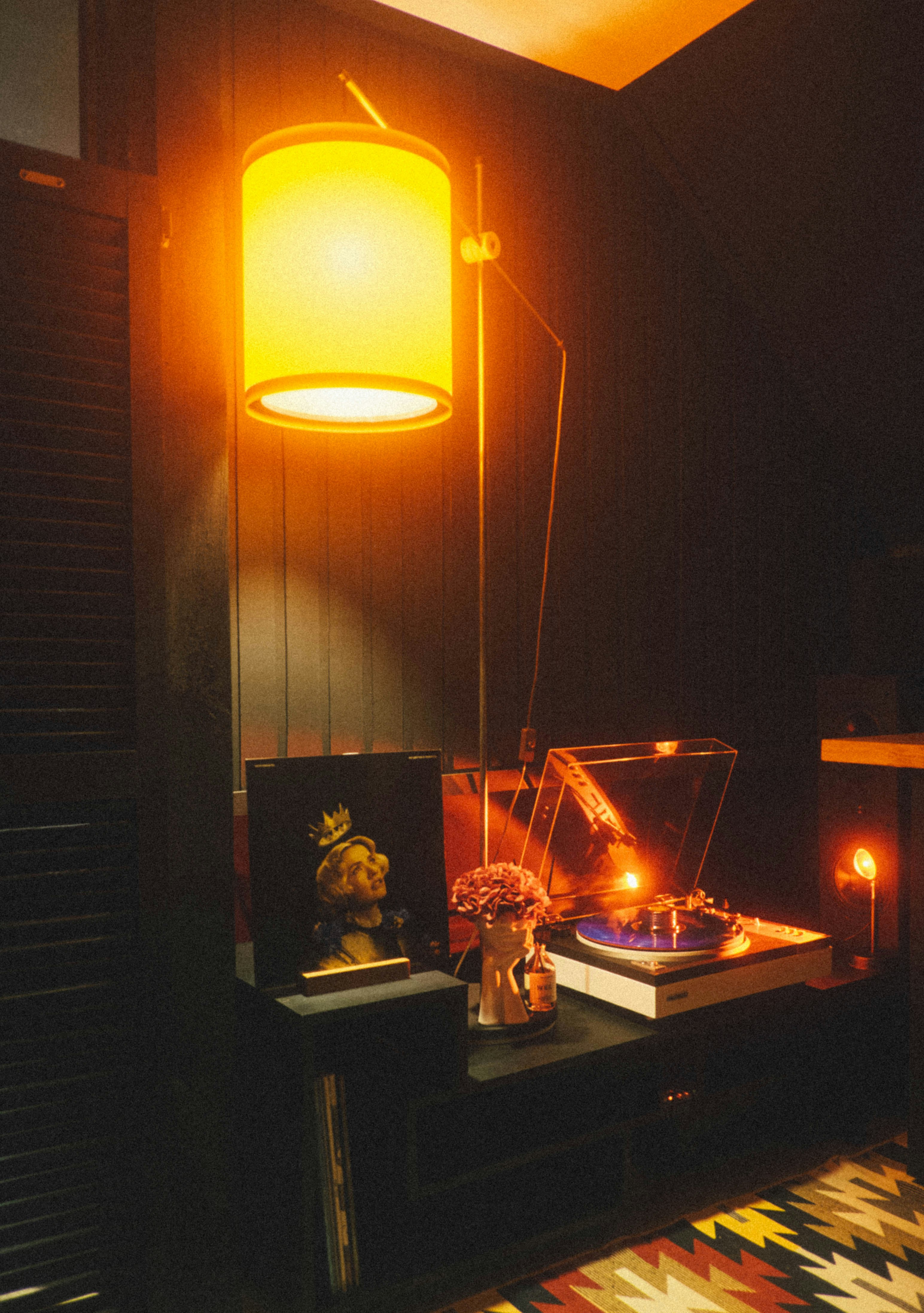 Warm Grove: A Cozy Night with Vintage Vinyl and a Glowing Lamp