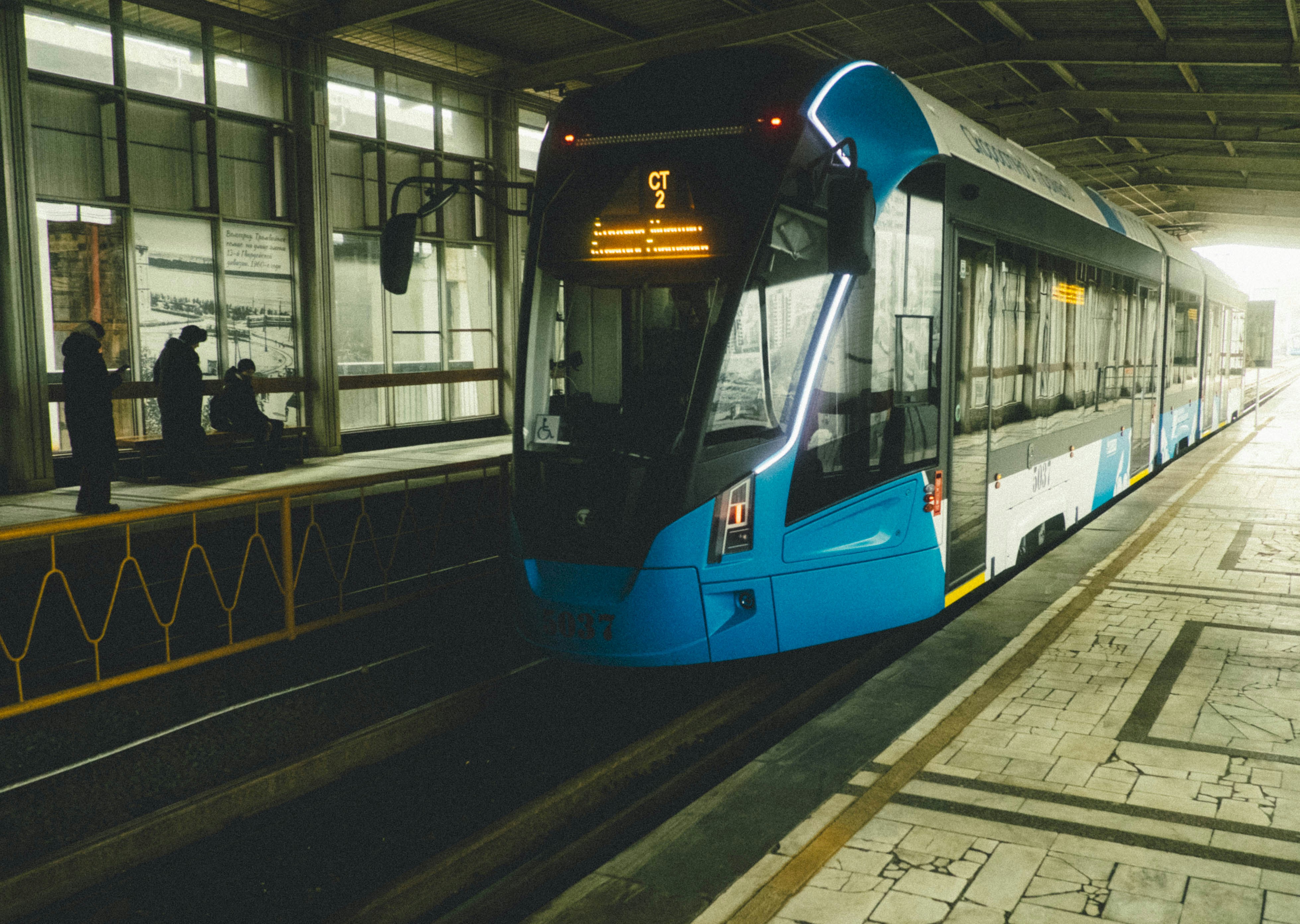 Blue Metro Awakening: A Modern Train at a Quiet Platform