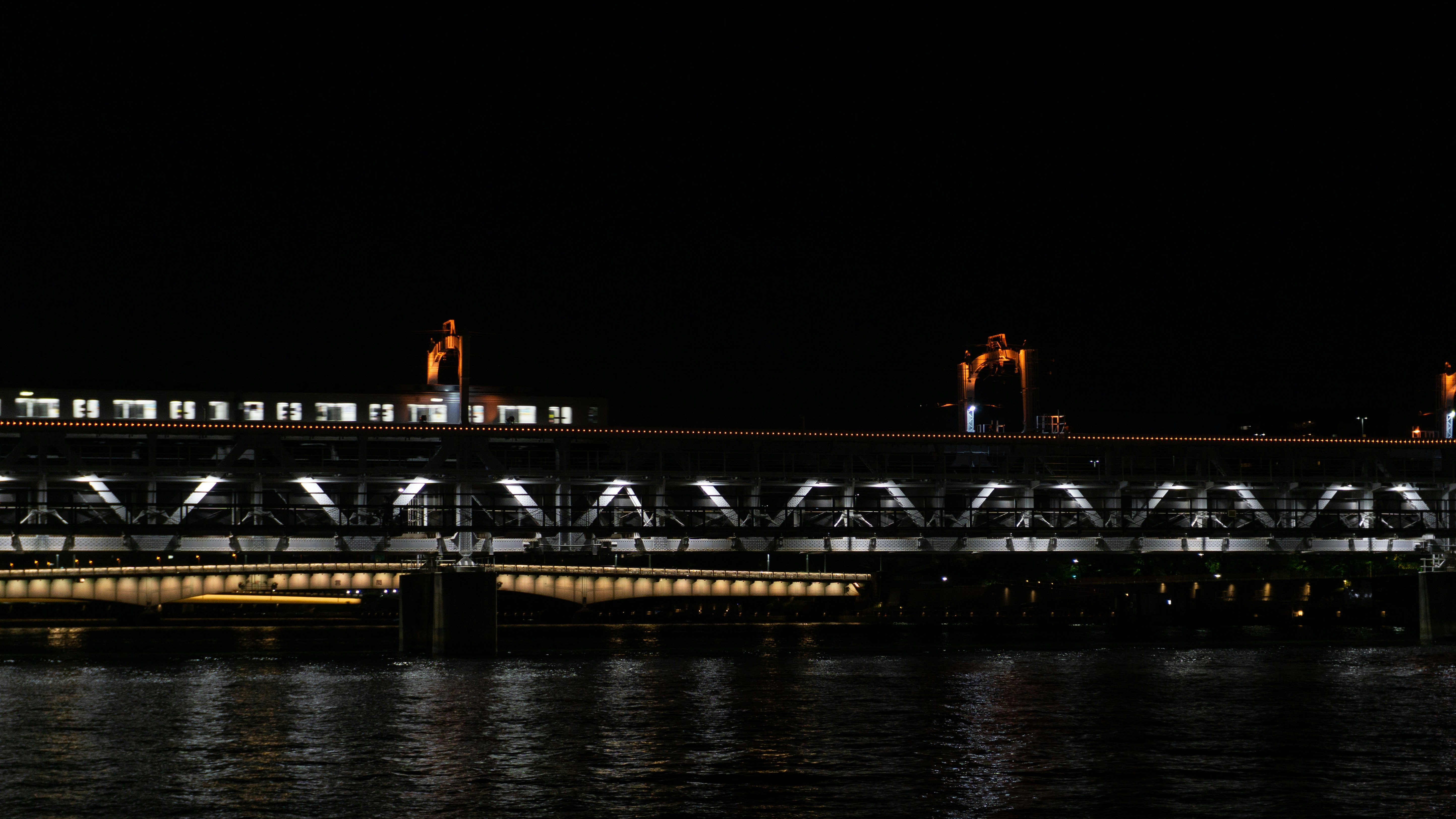 Nighttime Bridge in Glassy Water