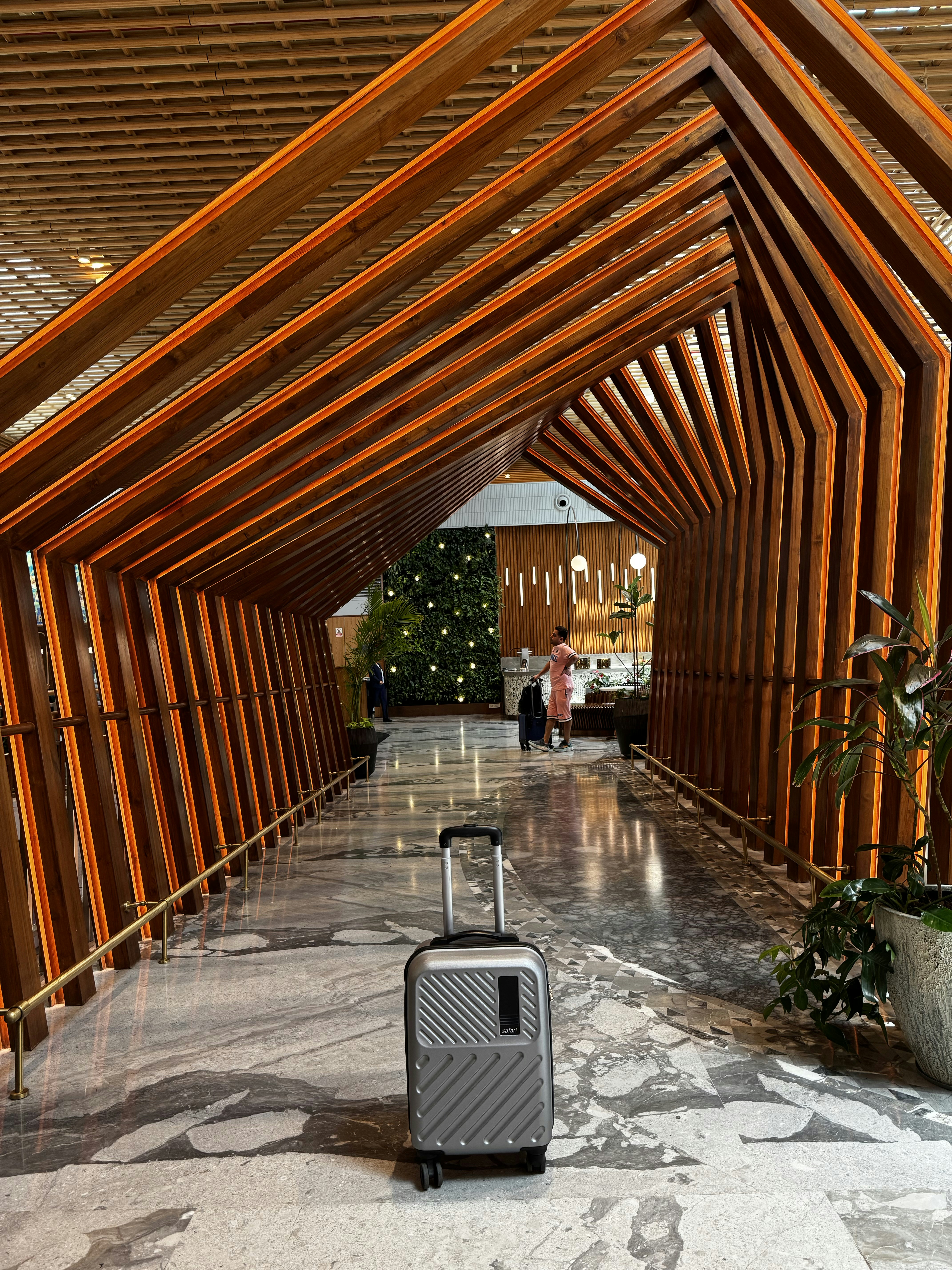 Traveler in a Geometric Wooden Walkway with Rolling Suitcase