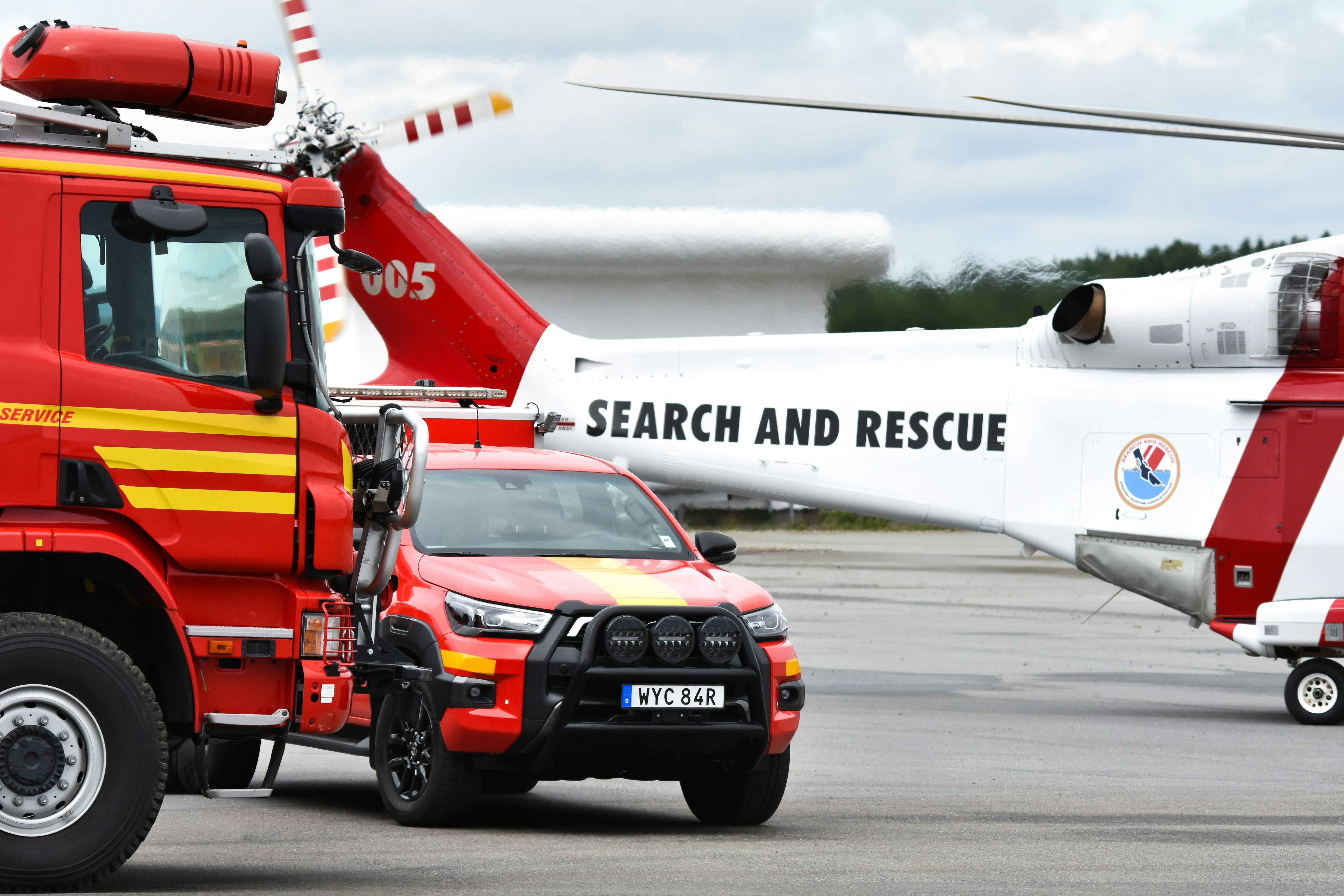 On-Cight Coordination: A Fire Truck and Rescue Helicopter at the Tarmac
