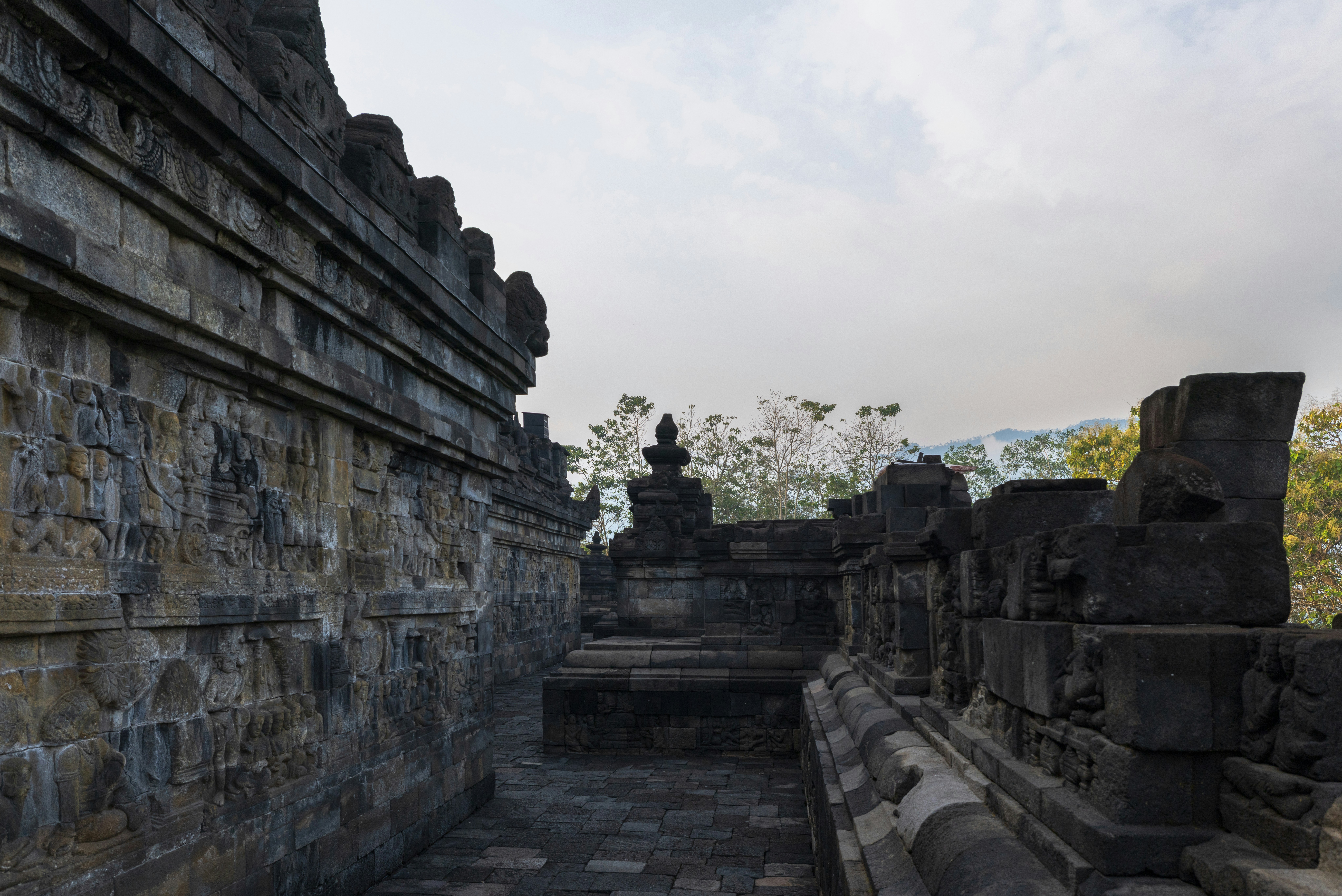 Ancient stone temple walls and structures against the sky.