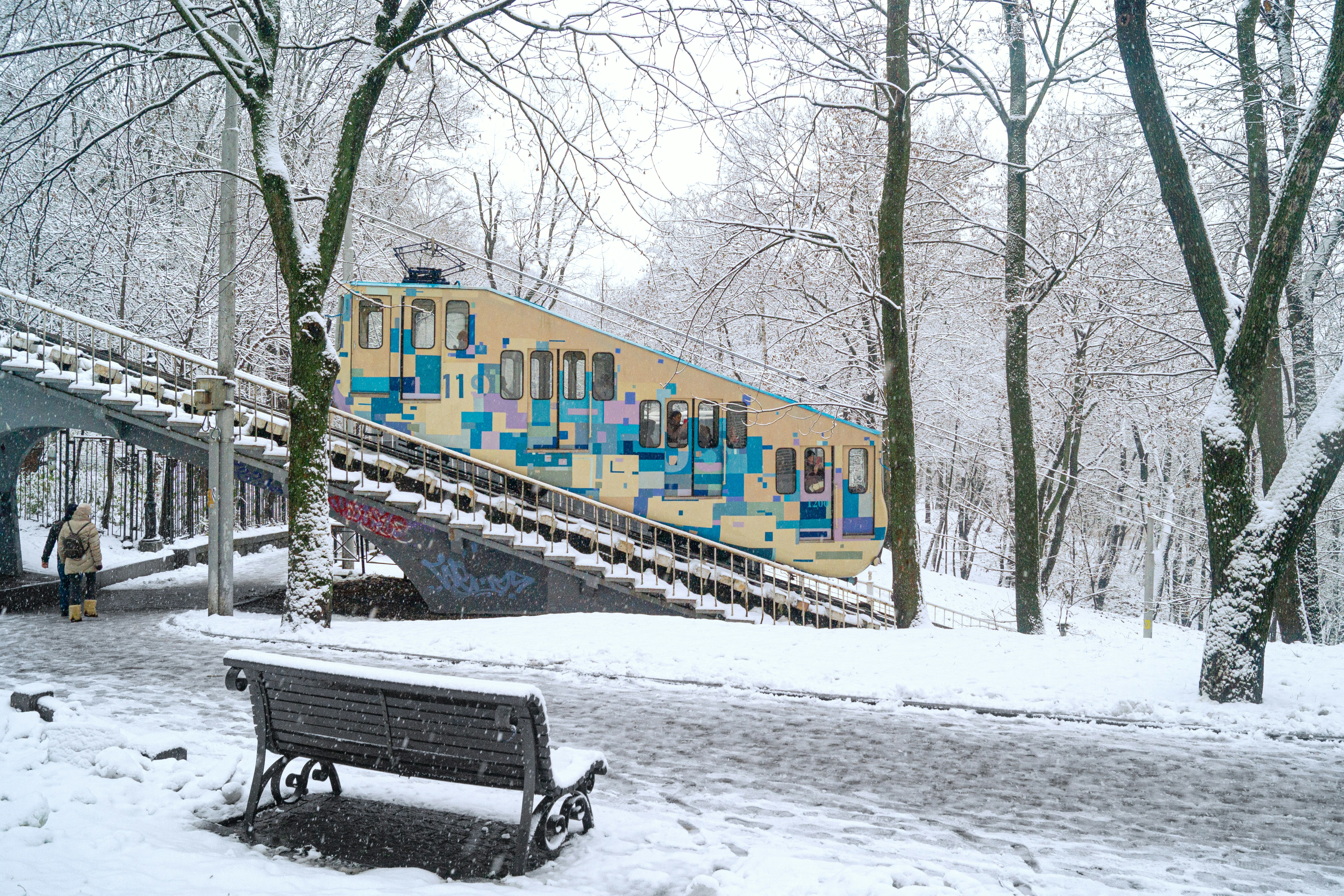 Snowbound Railyard: A Painted Train Halts in a Quiet Park
