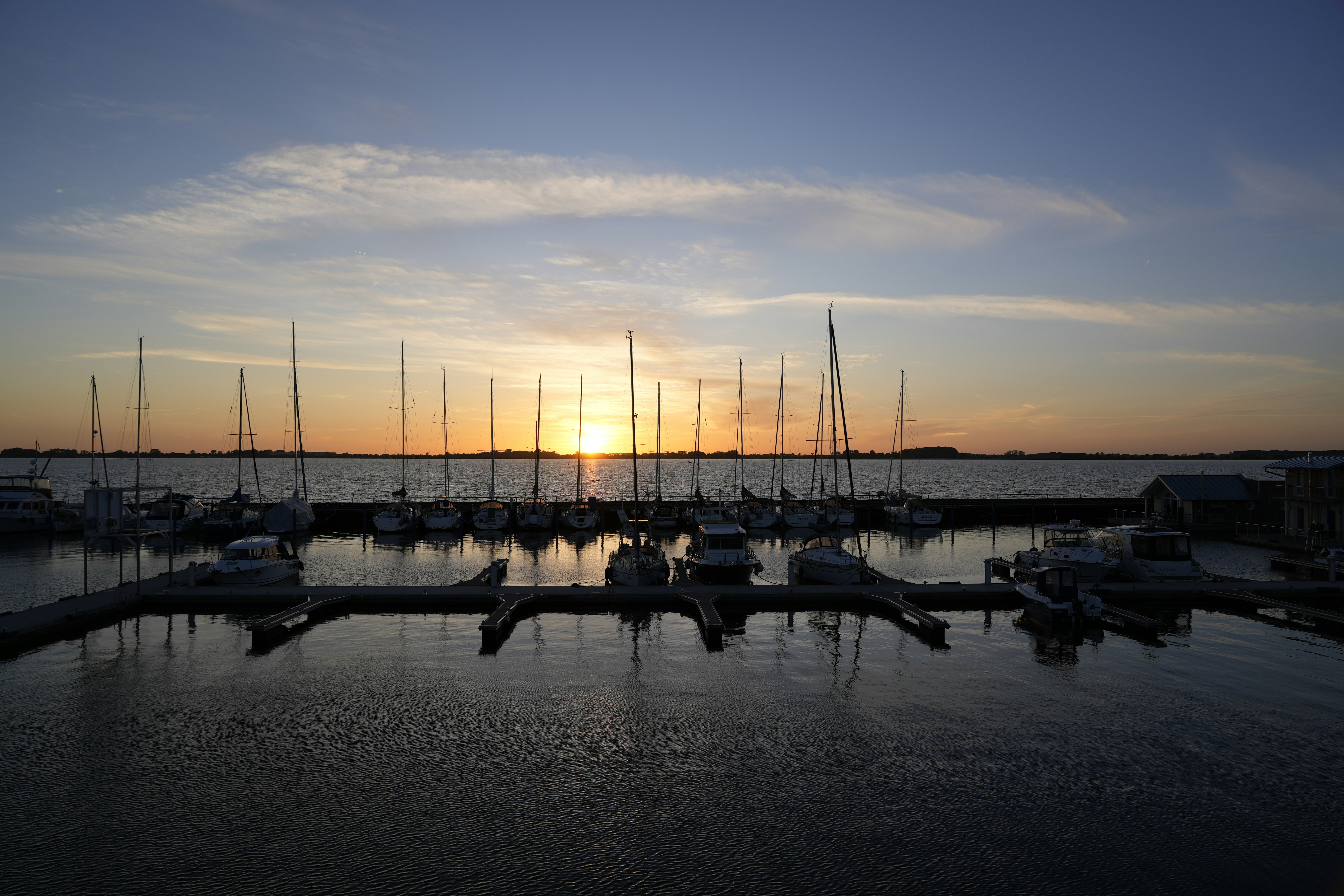 Dusk at the Marina: Boats Rest as the Sun Drops