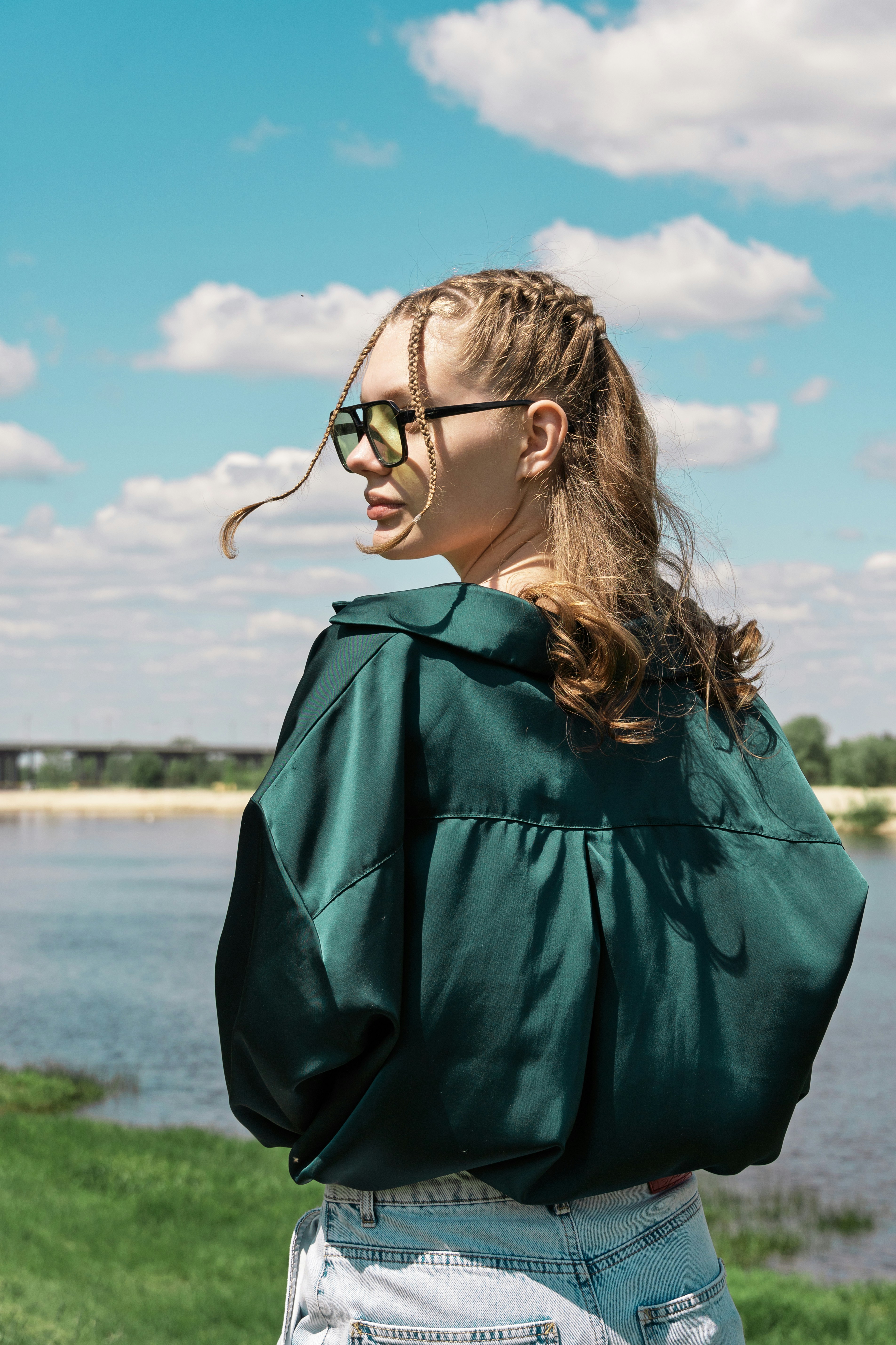 Portrait in teal: a wind-swept moment by the lakeside