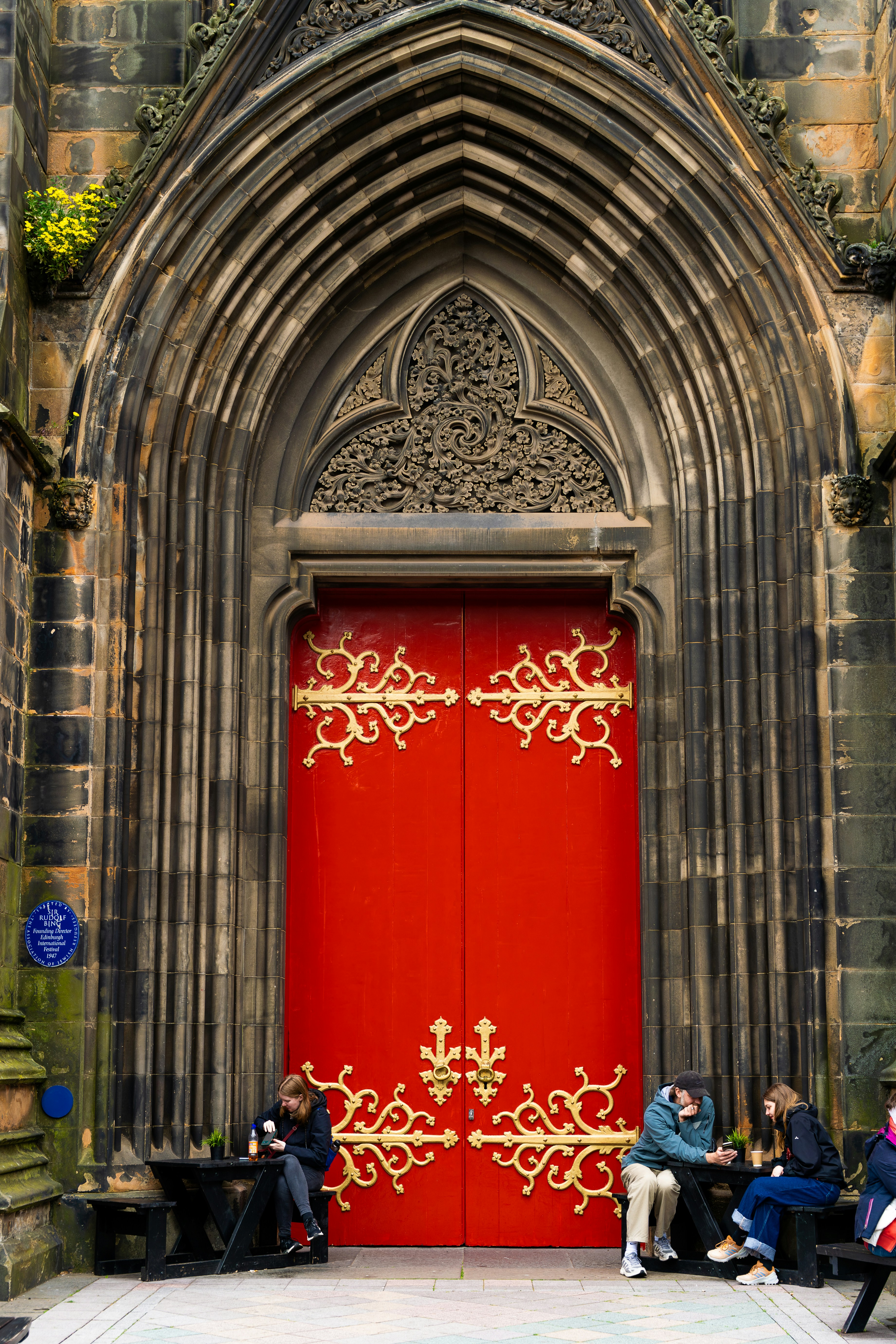 Red Doorway of Time: People at a Gothic Threshold
