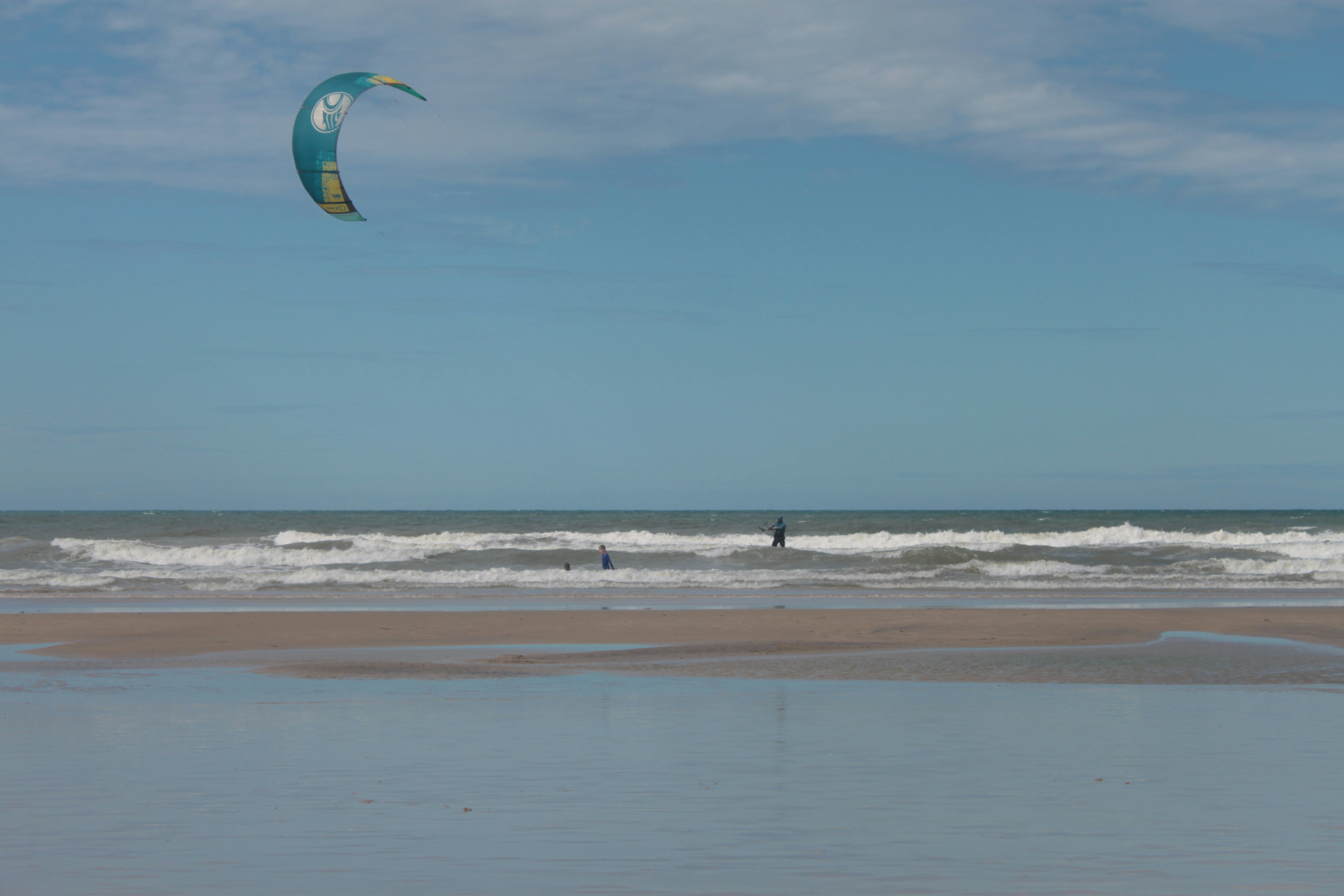 Kite Surfer on a Quiet Coastal Scene
