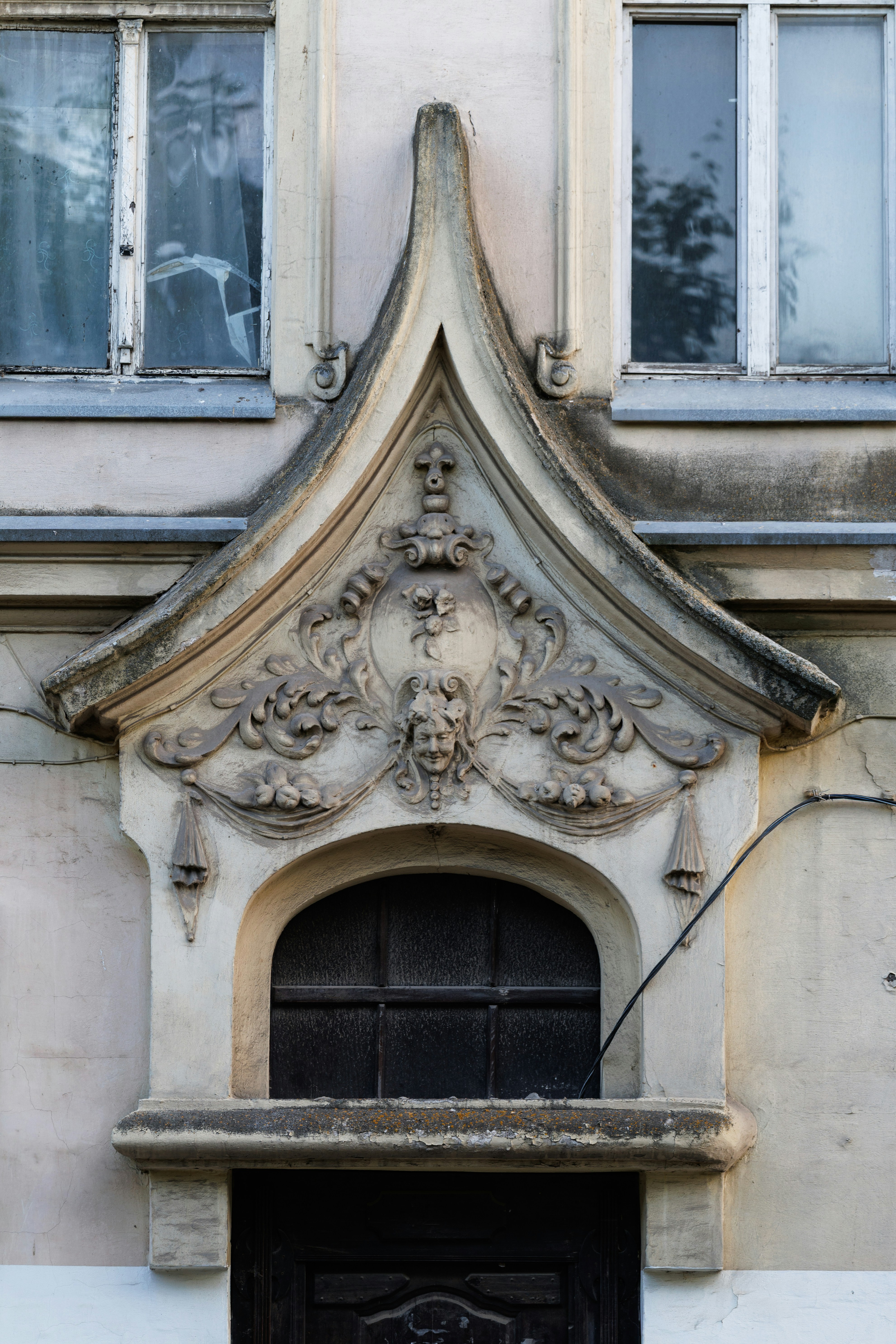 Ornate Archway of a Weathered Facade