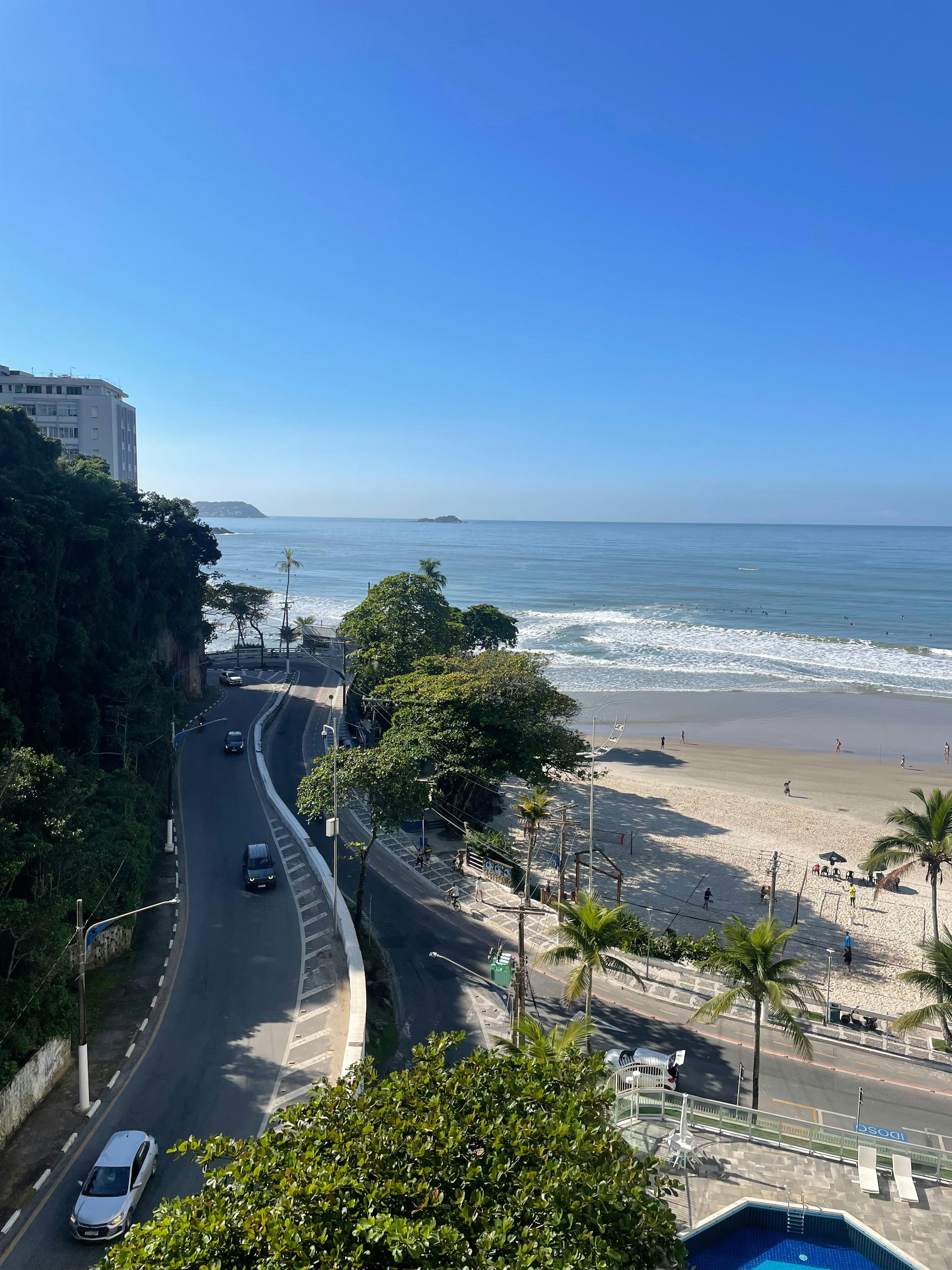 Coastal Terrace: A Sunset-Washed Beach framed by an Ocean Road