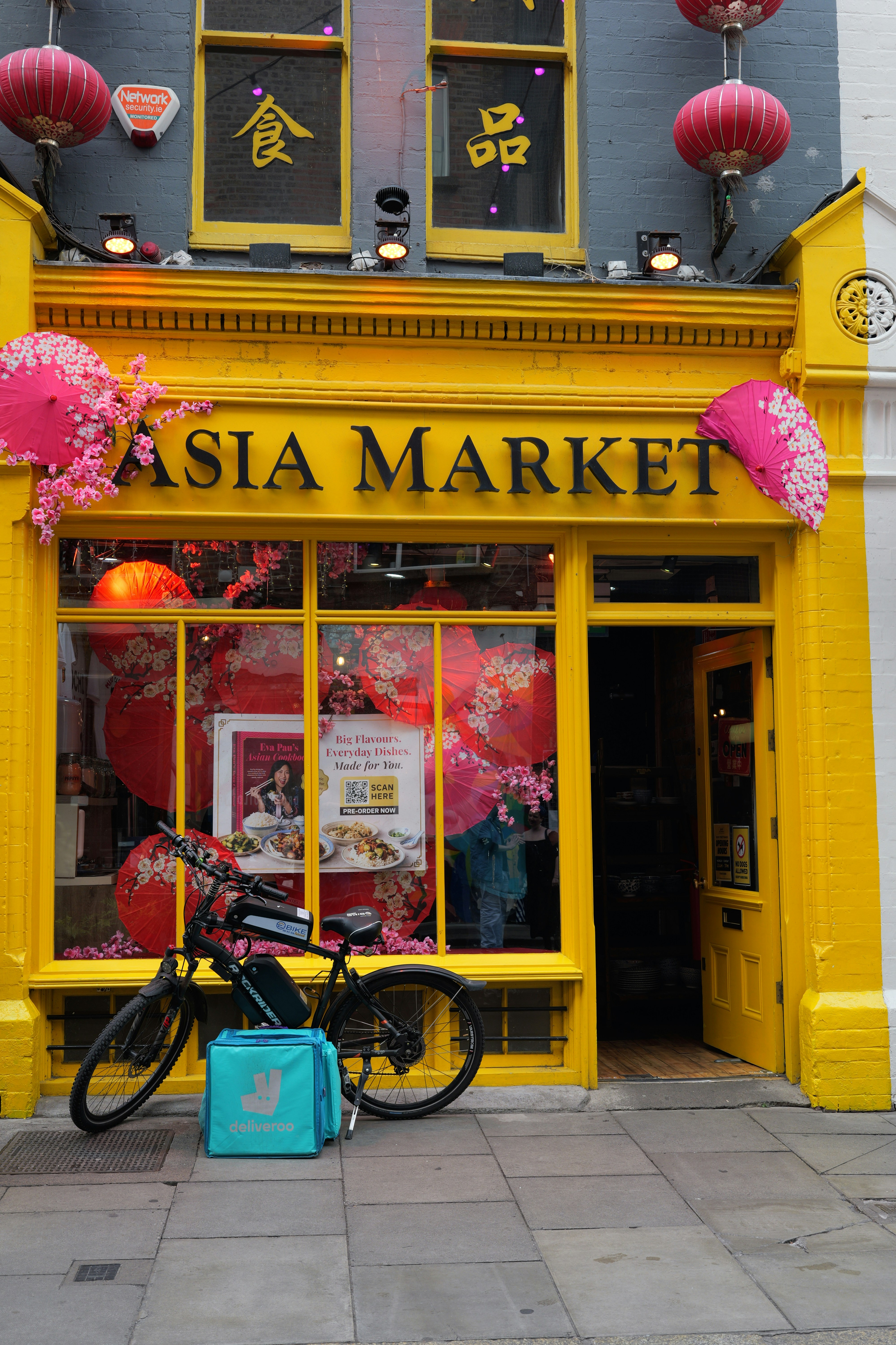 Bright Yellow China Shop Facade with Lantern Accents