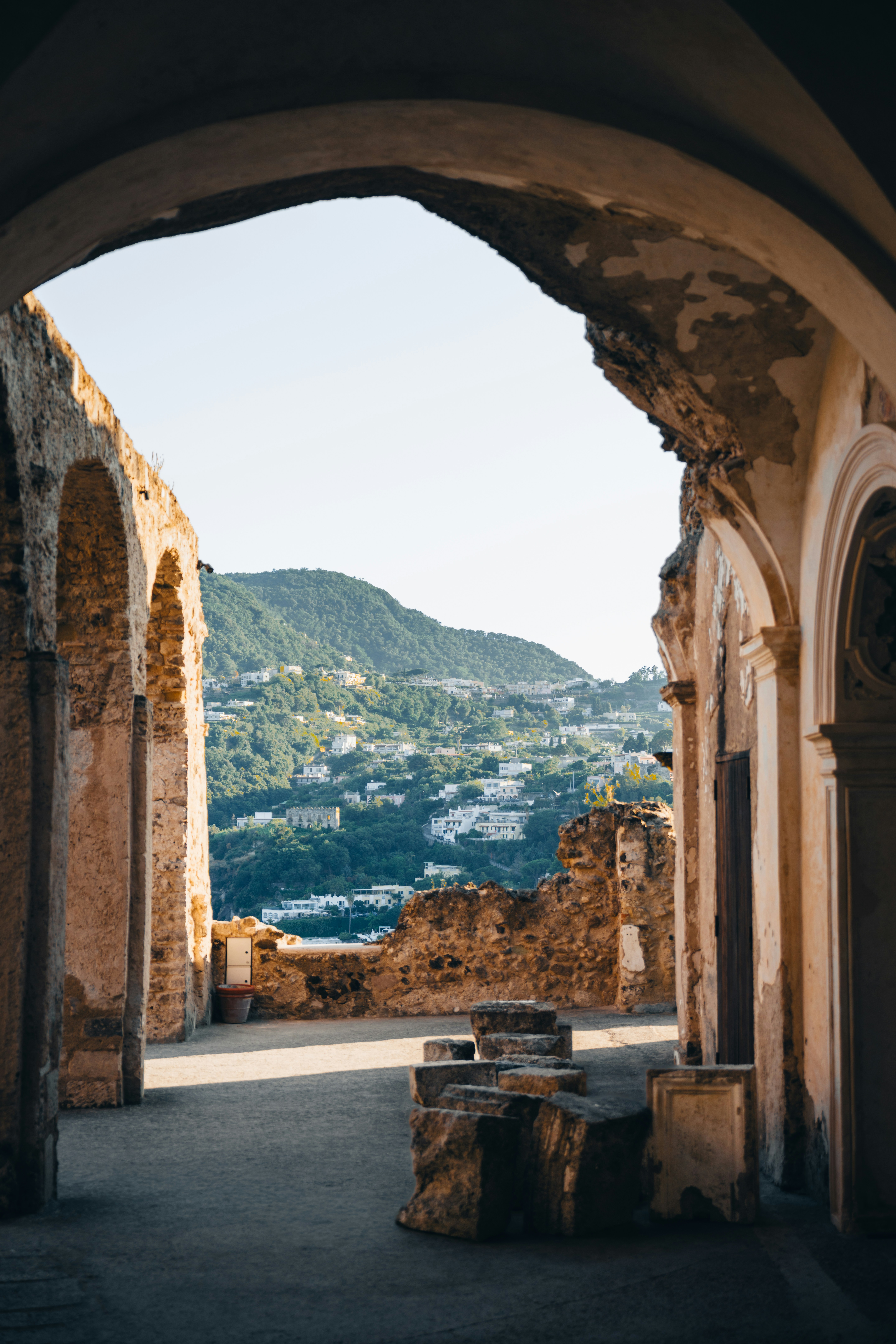 Through the Ruined Arch to a Coastal Village