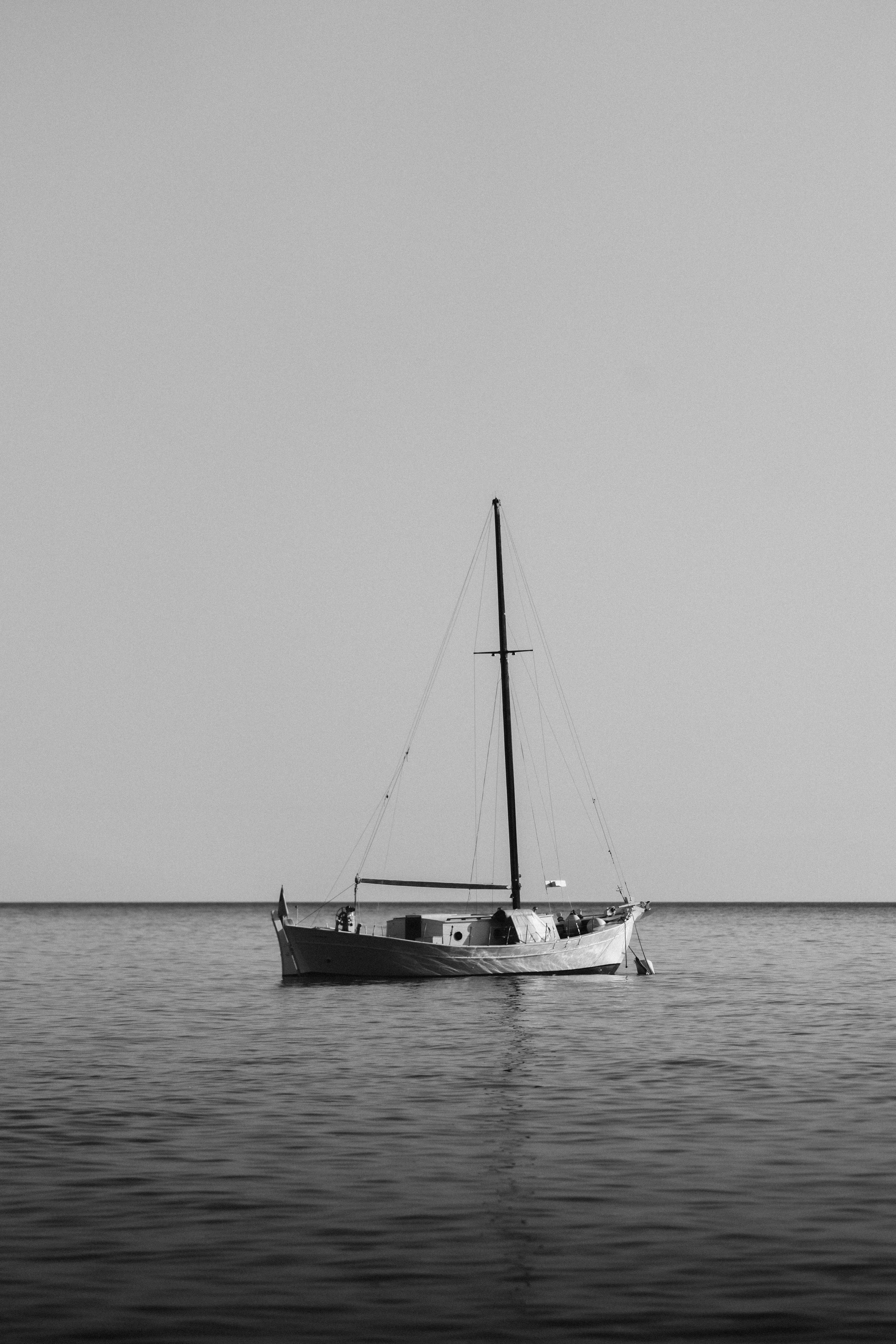 Solitary Sloop on a Quiet Sea