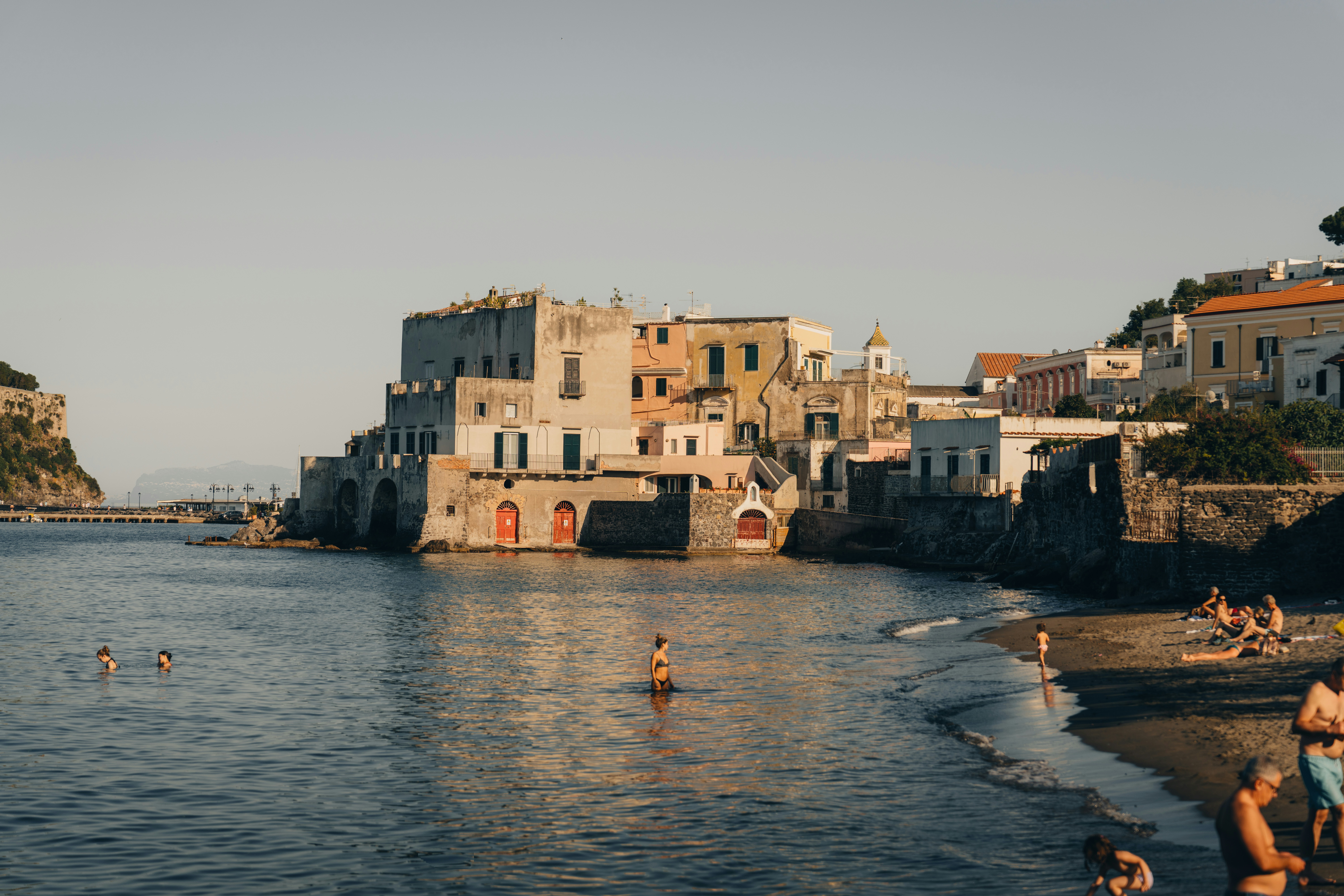 Harbor of Stone Buildings Quietly Embraces a Shallow Cove