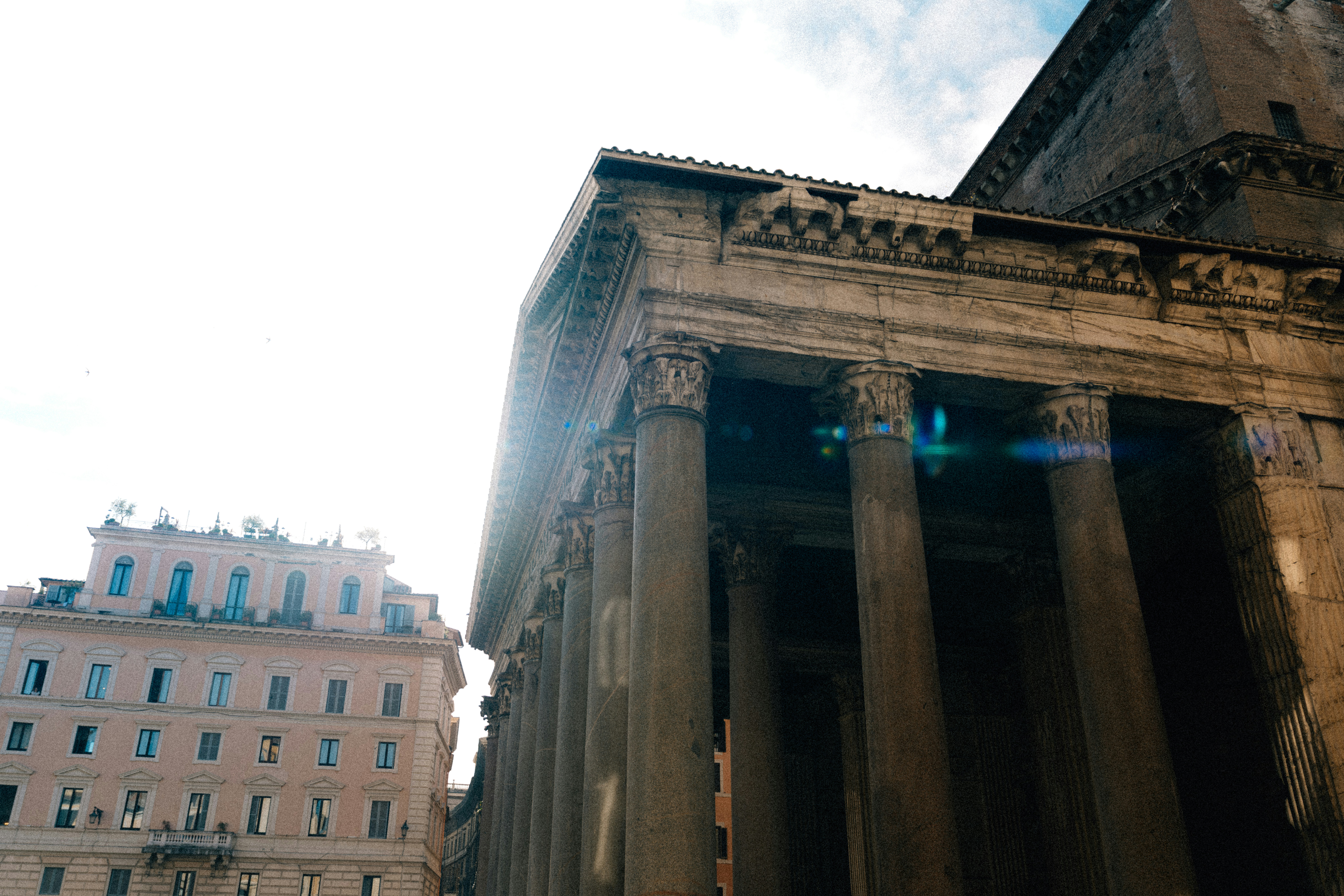 Ancient Facades Meet Rising Sun: A Street View of Classical Portico