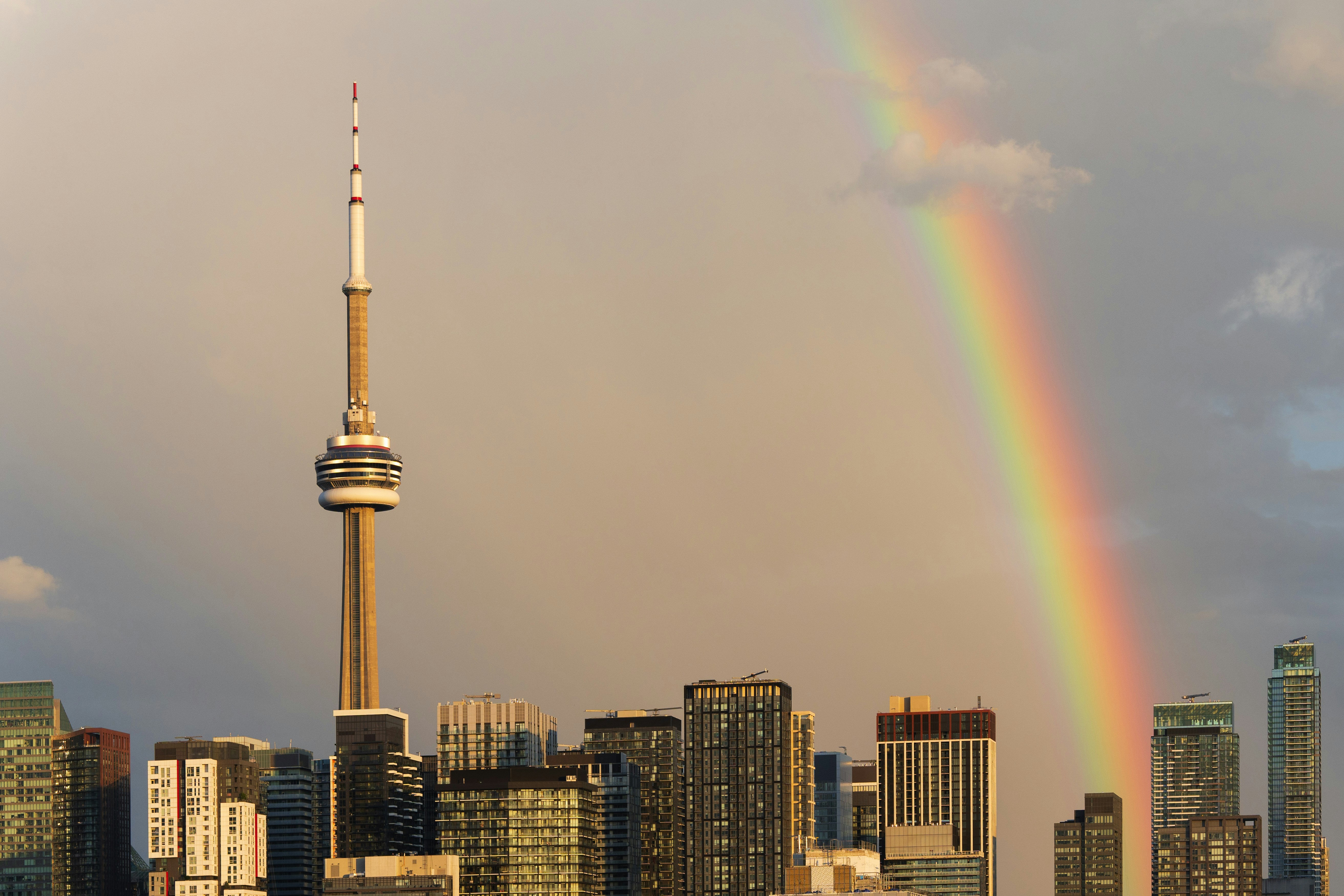 Rainbow Over the City: Tower, Sky, and Arc of Color