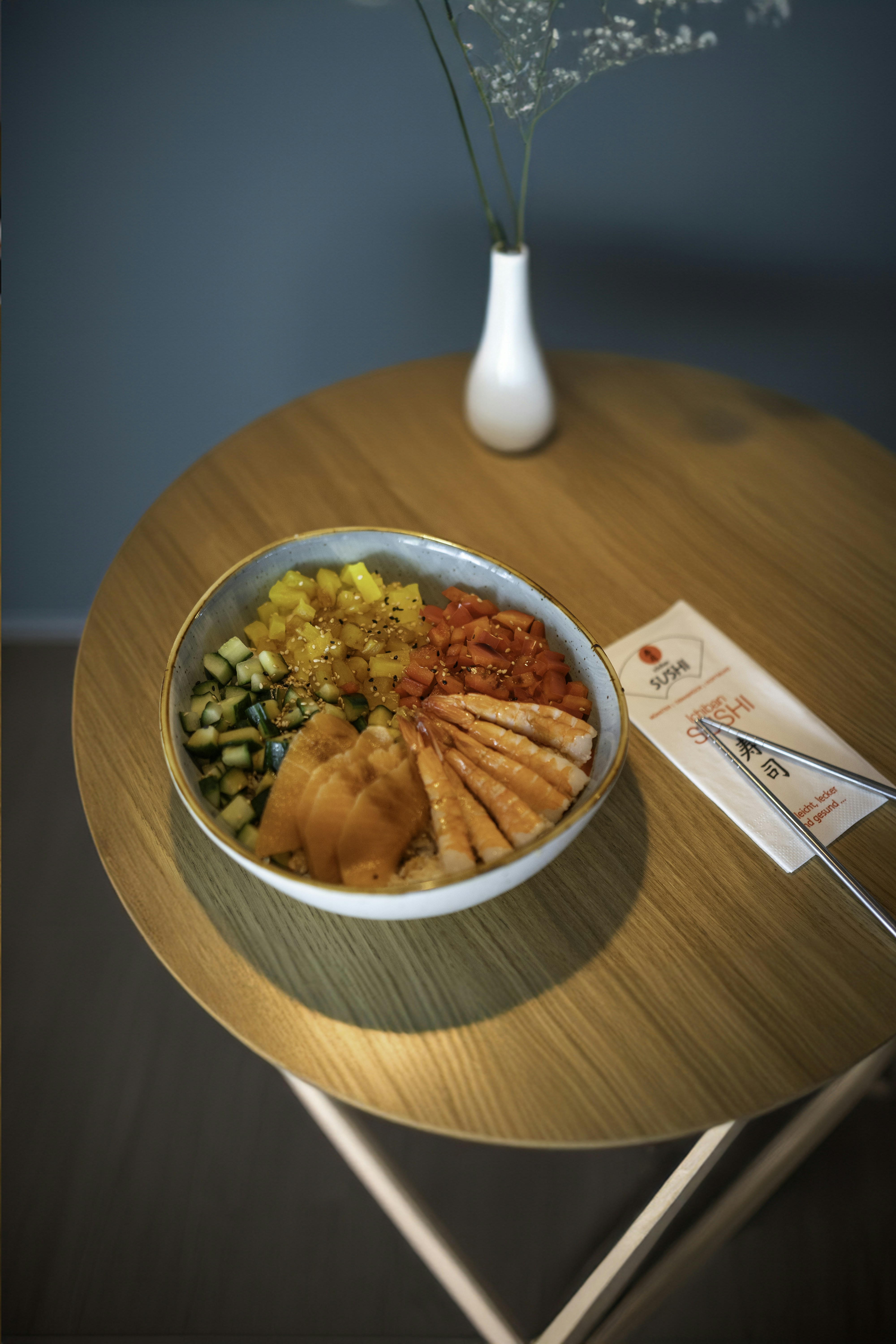 Rainbow Bowl on Riverside Table: A Tribal Platter in Evening Light