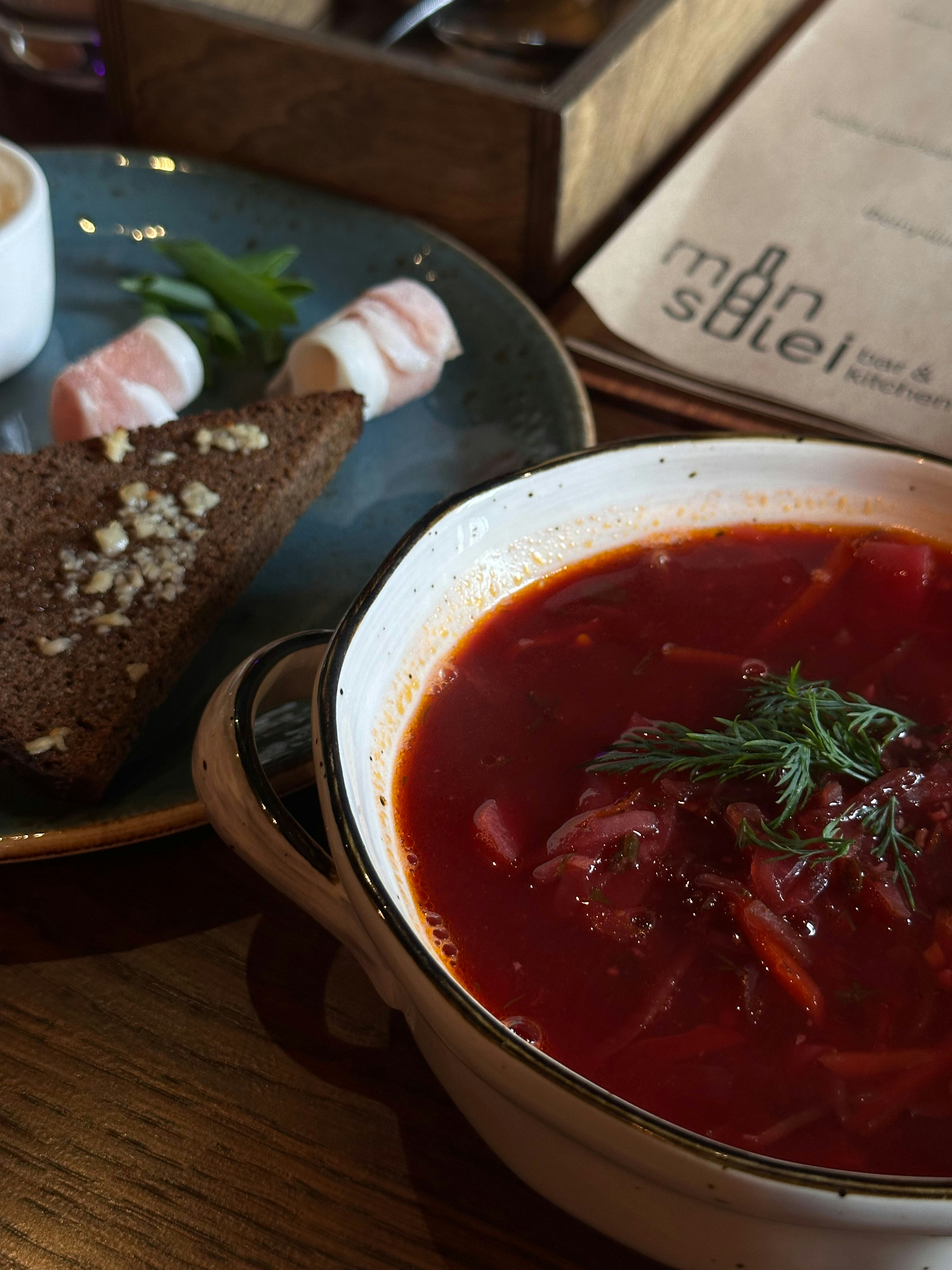Red Soup and Crust: A Cozy Plate with Rustic Bread