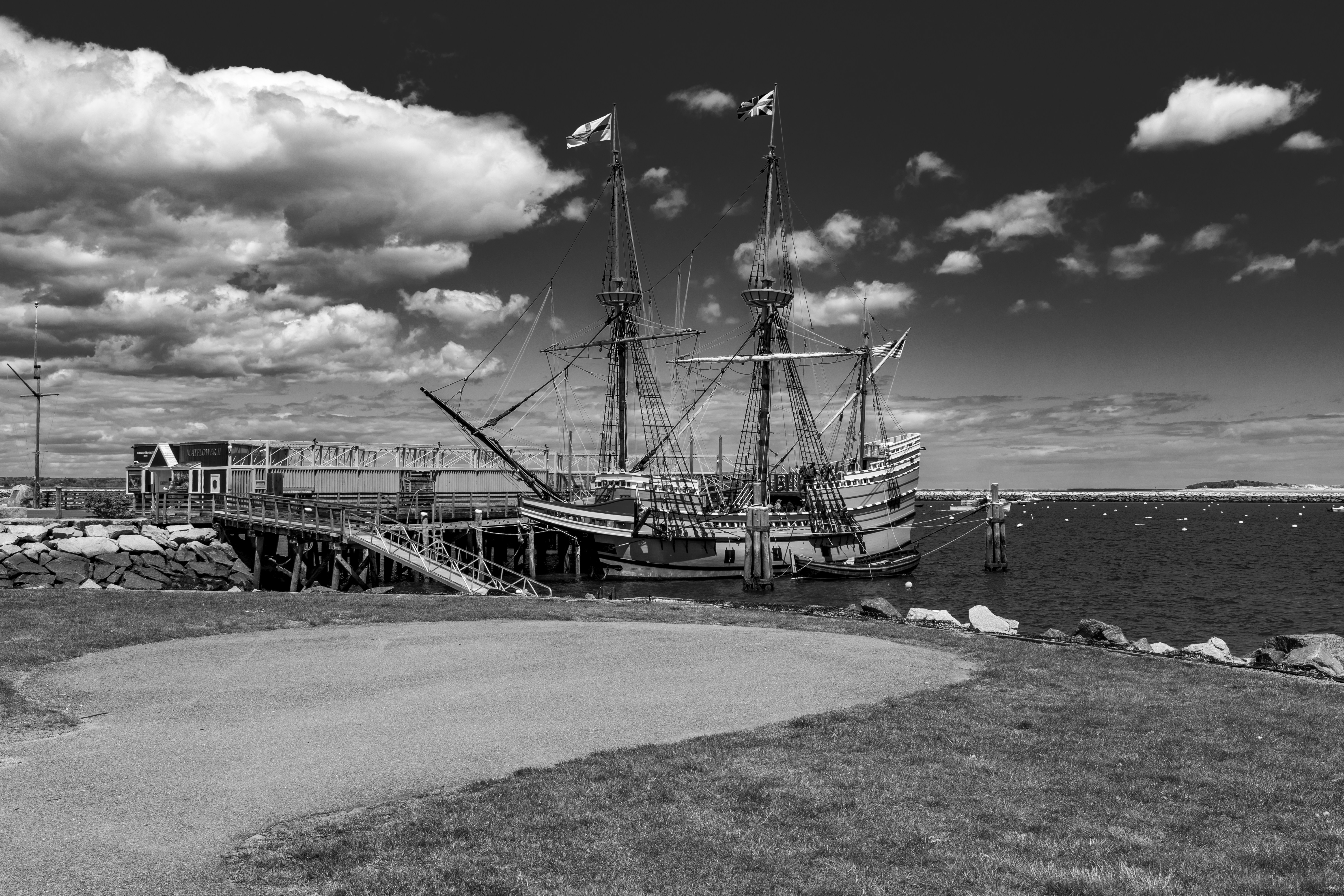 Sailing Ship at the Pier in Quiet Black-and-White Harbor