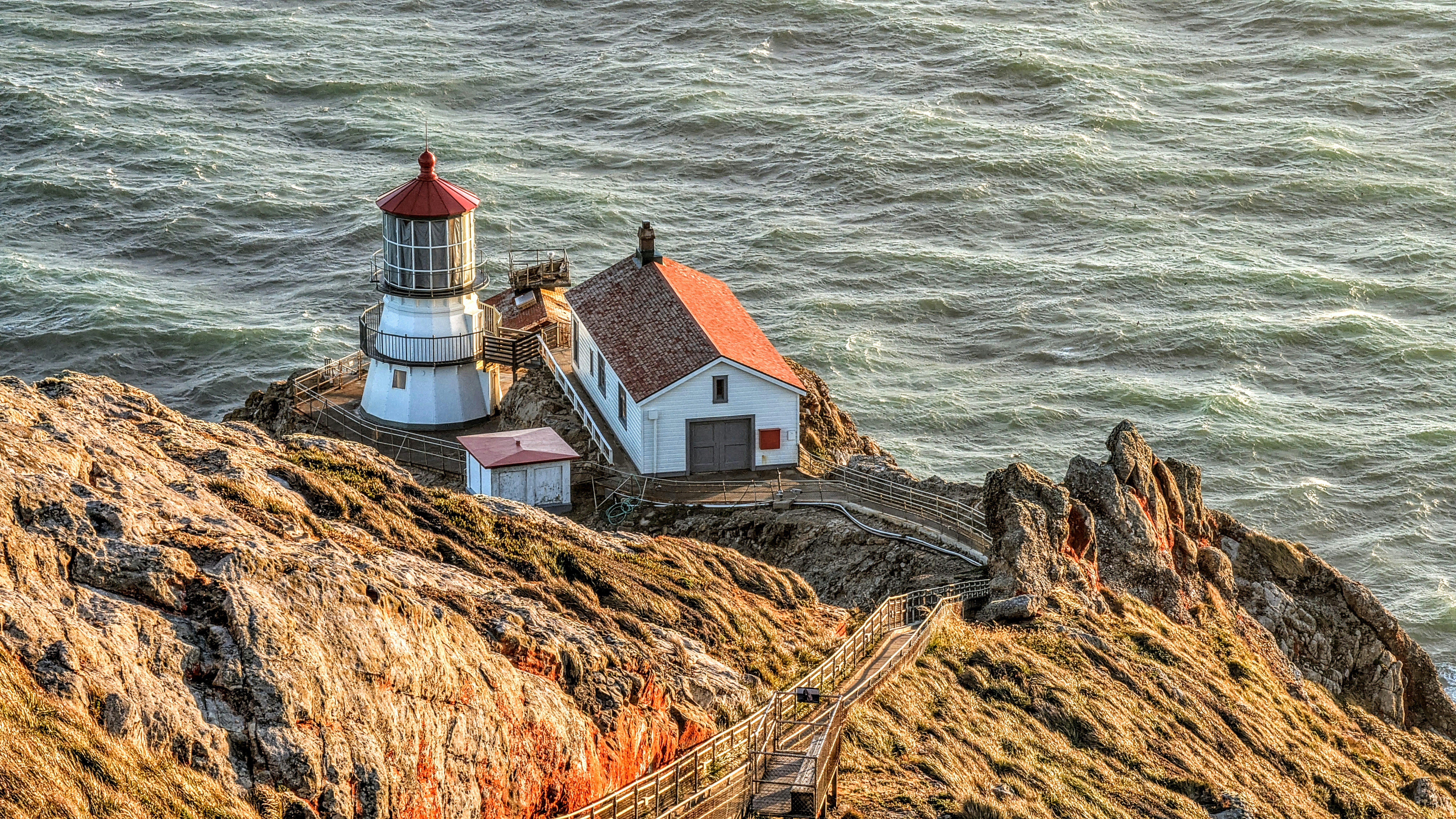Lighthouse Retreat: A Rugged Cliffside Beacon Overlooking the Sea