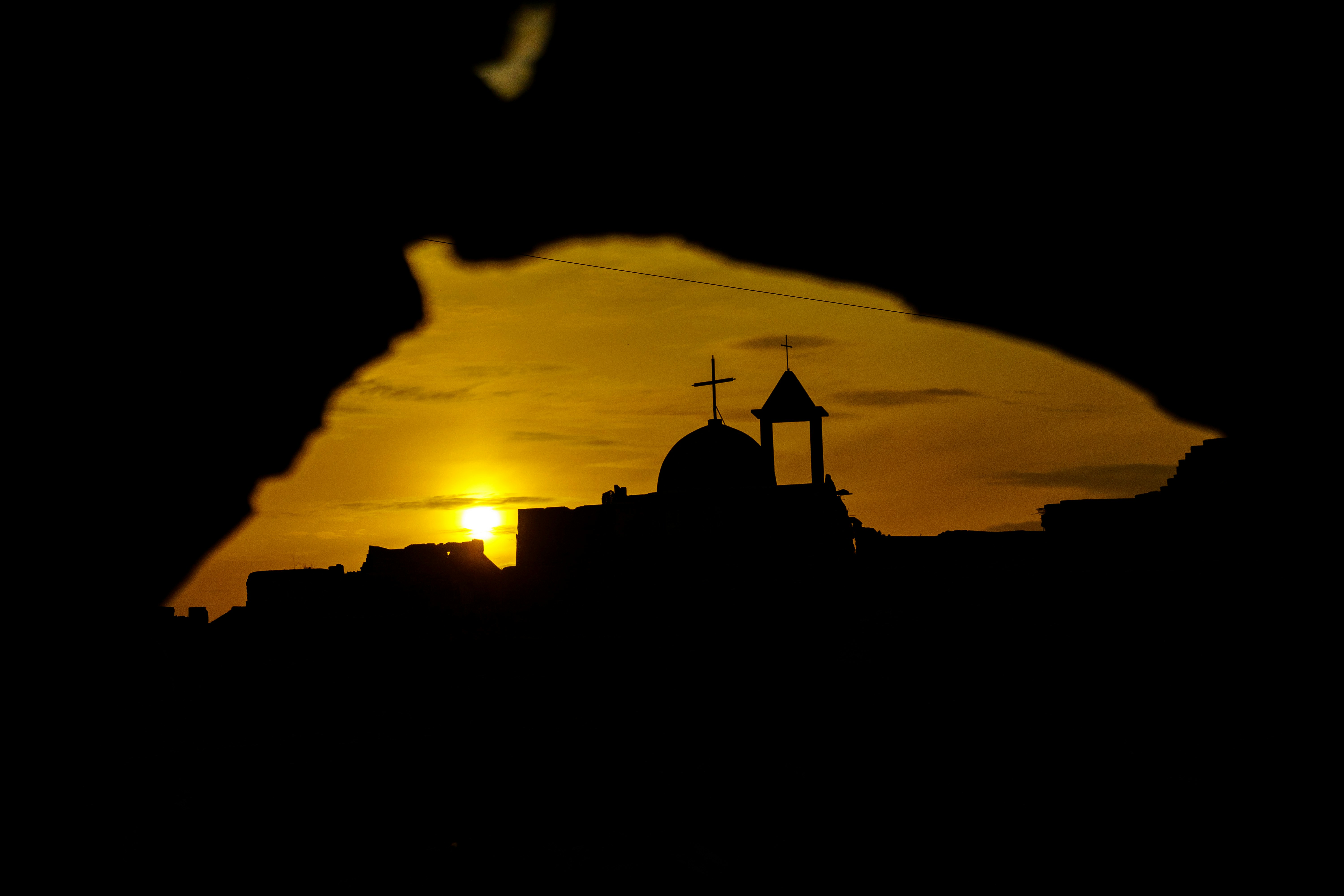Sunset Silhouette Over a Quiet Bell-Tower Horizon