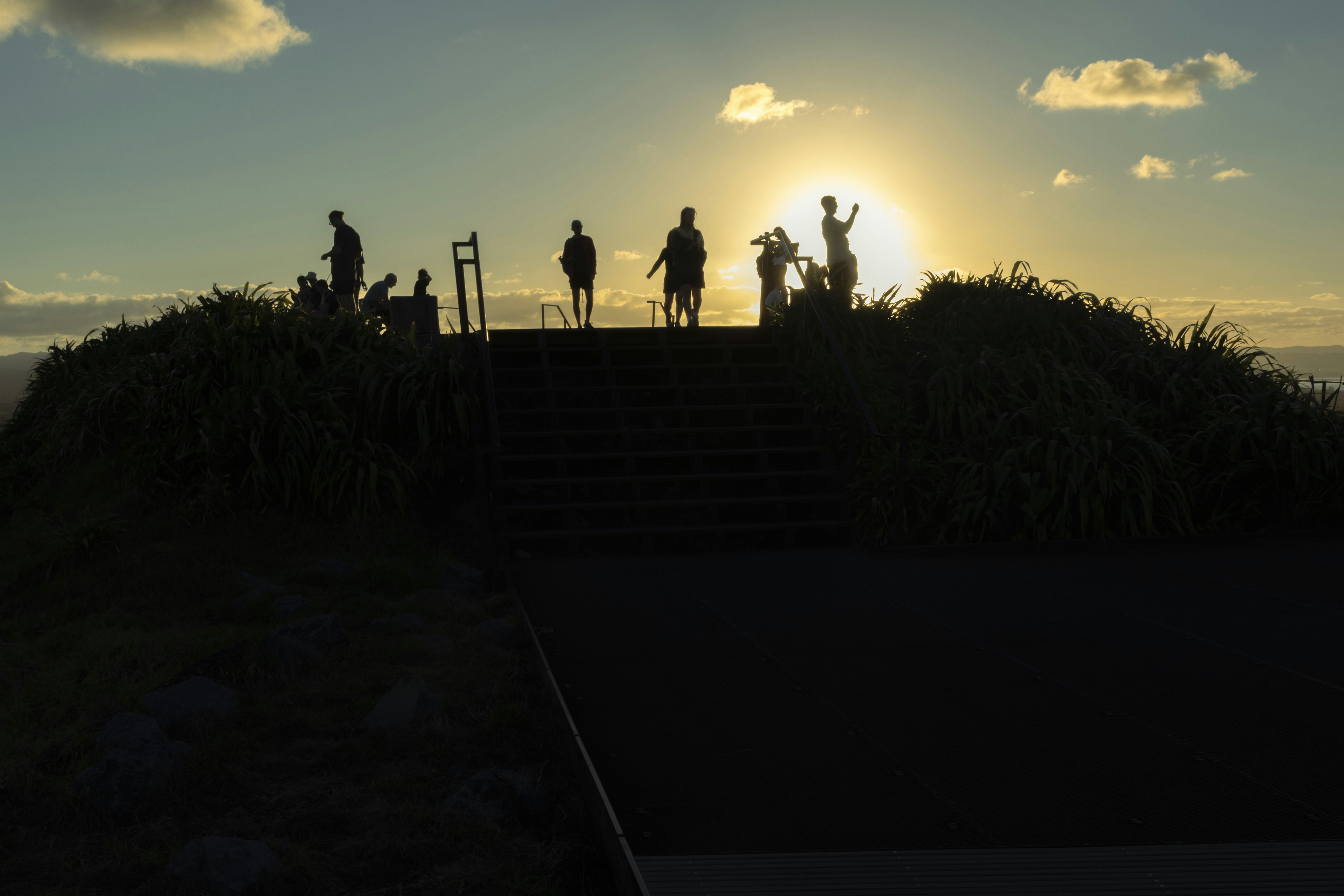 Sunset Silhouette: A Band of Figures at the Edge of Light