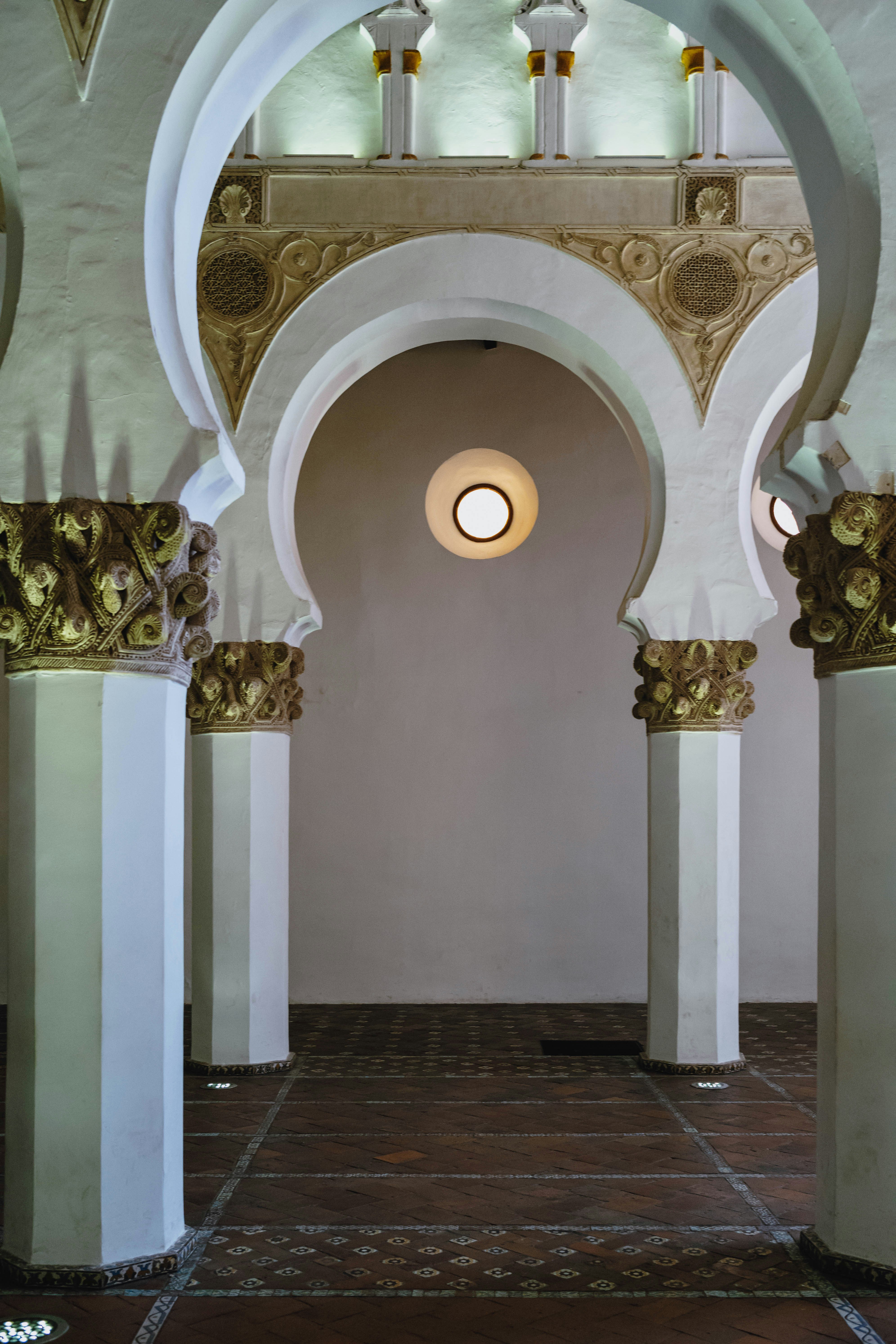 Arched Cloister: Light Circles Through Central Arch