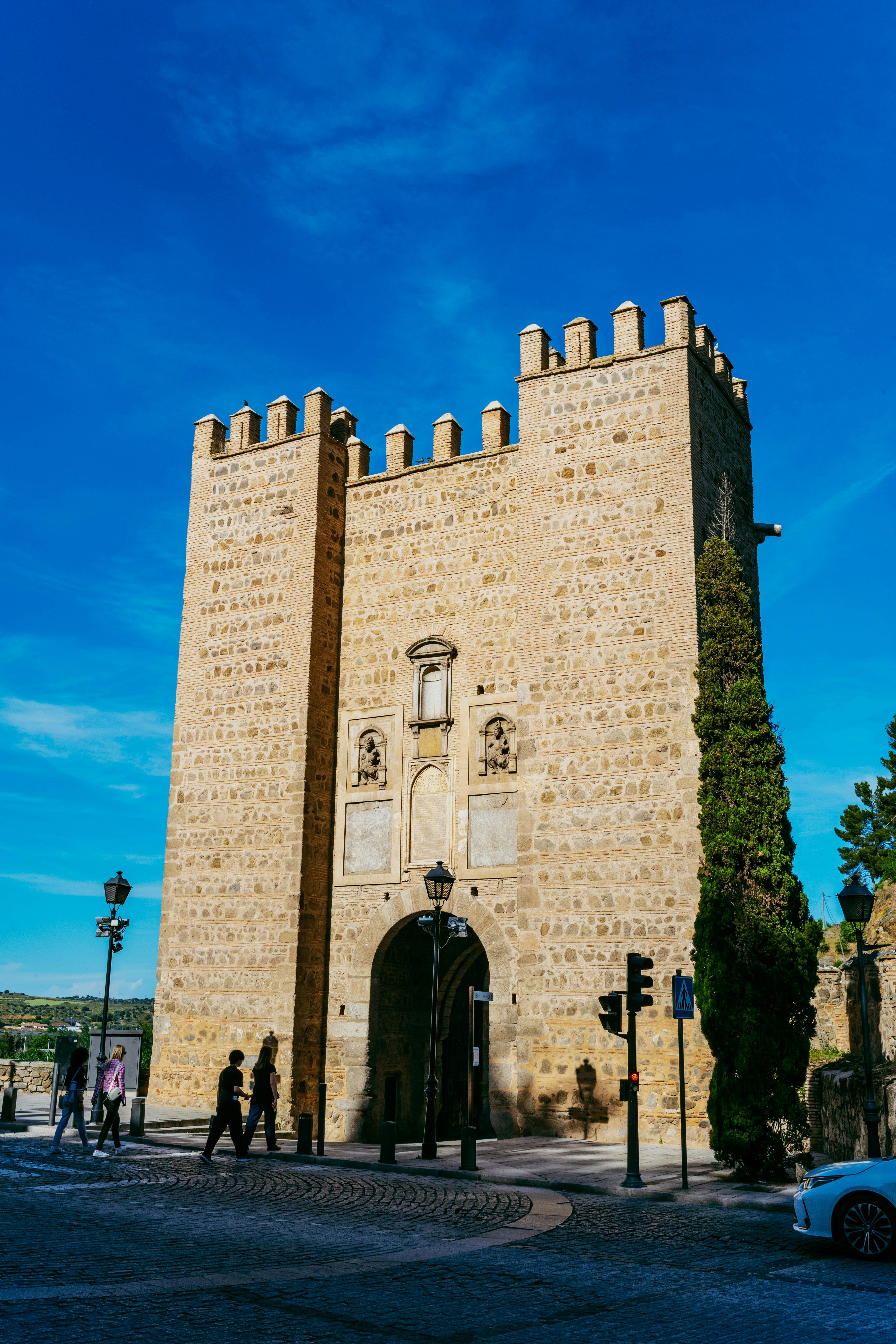 Stone Gatekeeper: A Tuscan-Tinted Tower Standing Against a Cerulean Sky