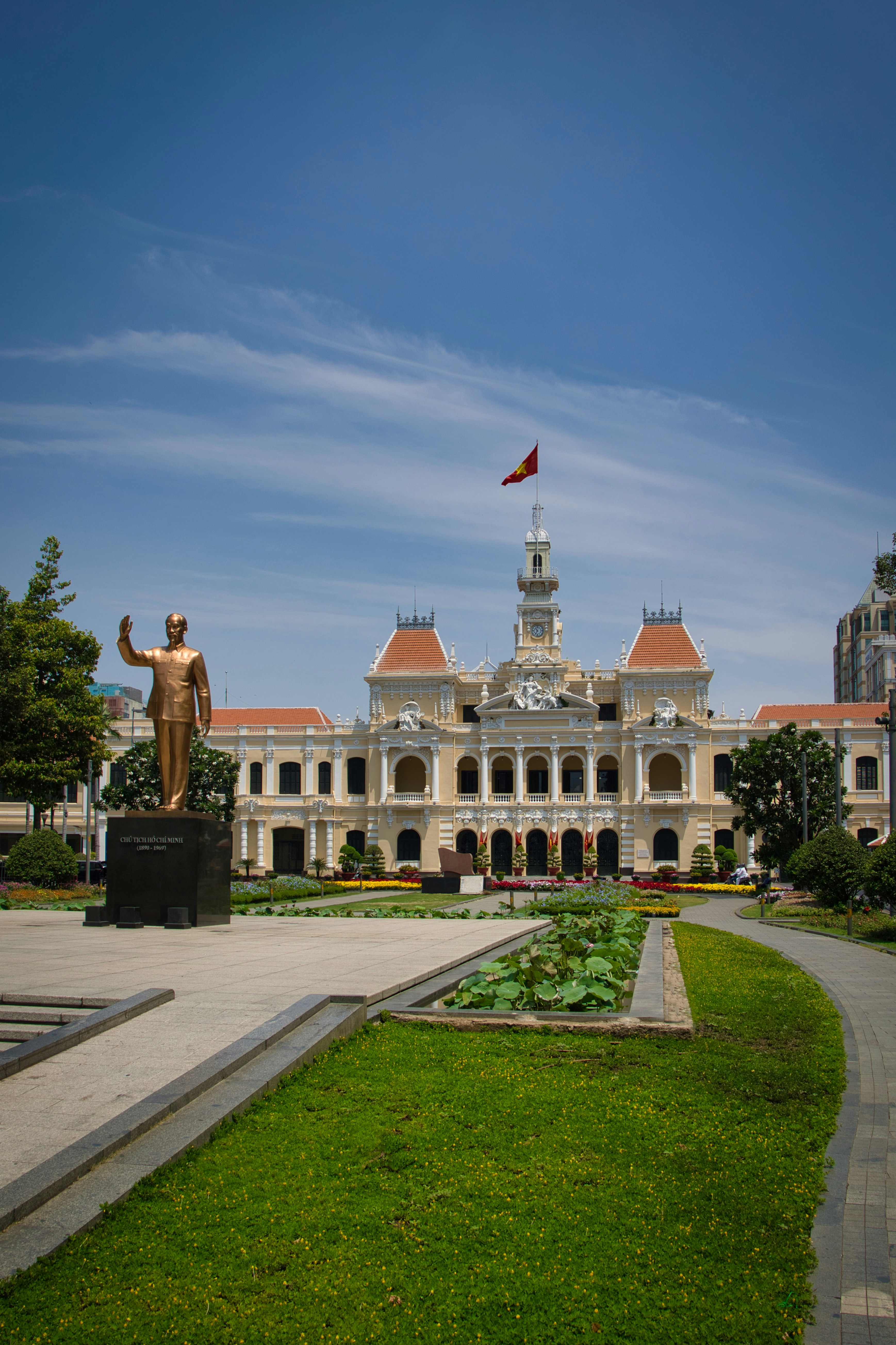 Front Courtyard of a Civic Building with Statue and Flag