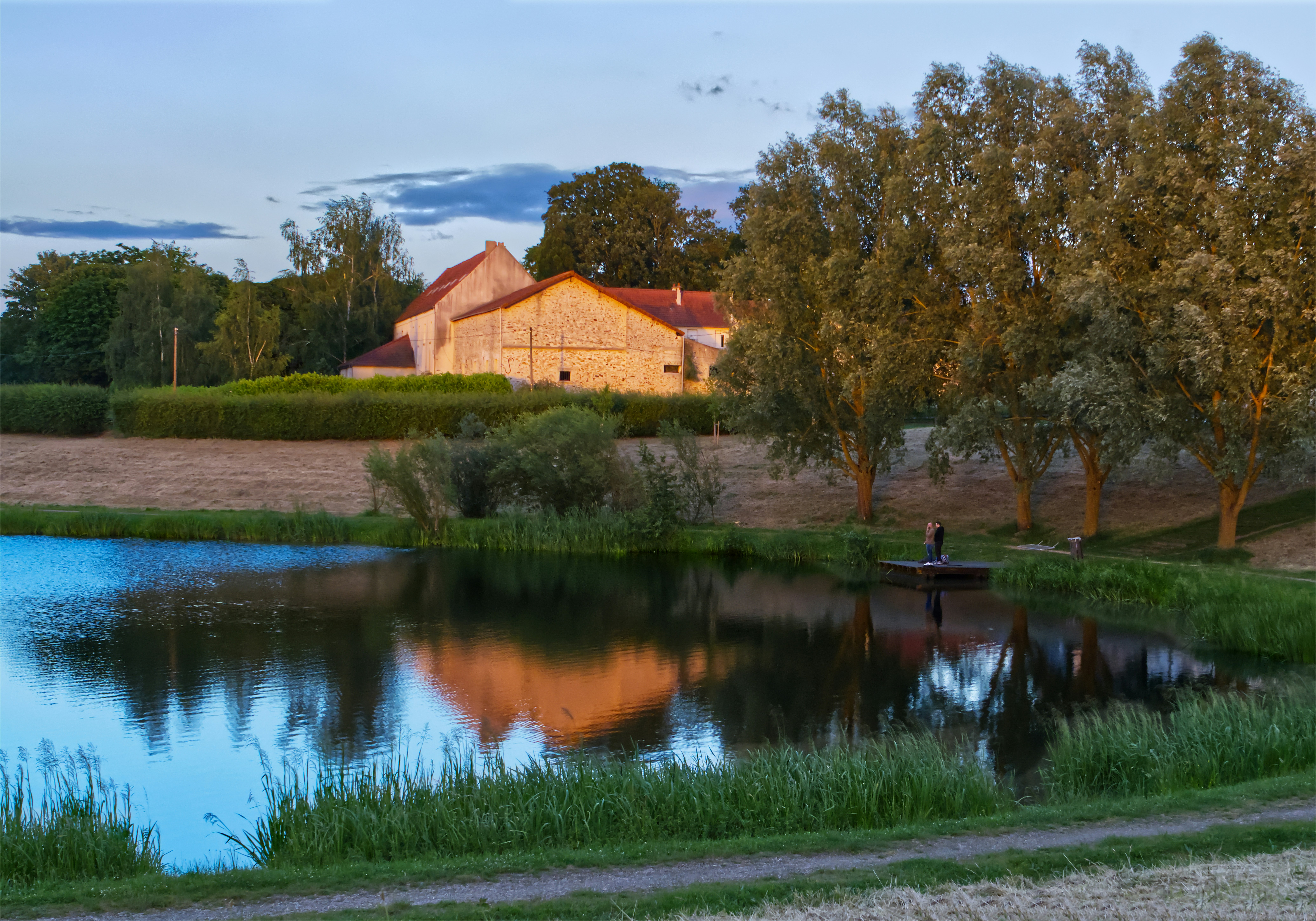 Riverside Farmhouse Reflecting in Evening Calm