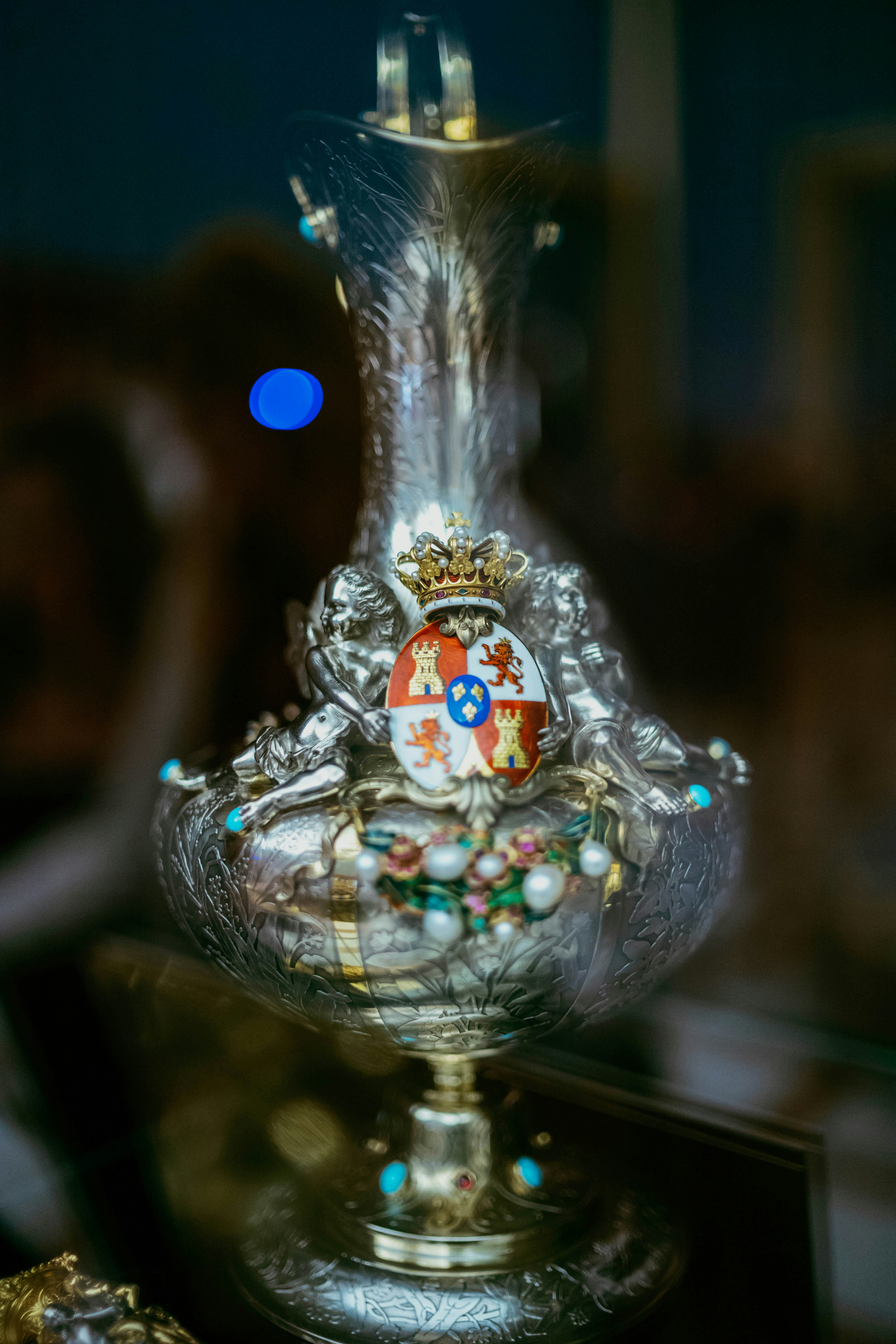 Regal Crest: A jeweled decanter crowned with heraldic detail