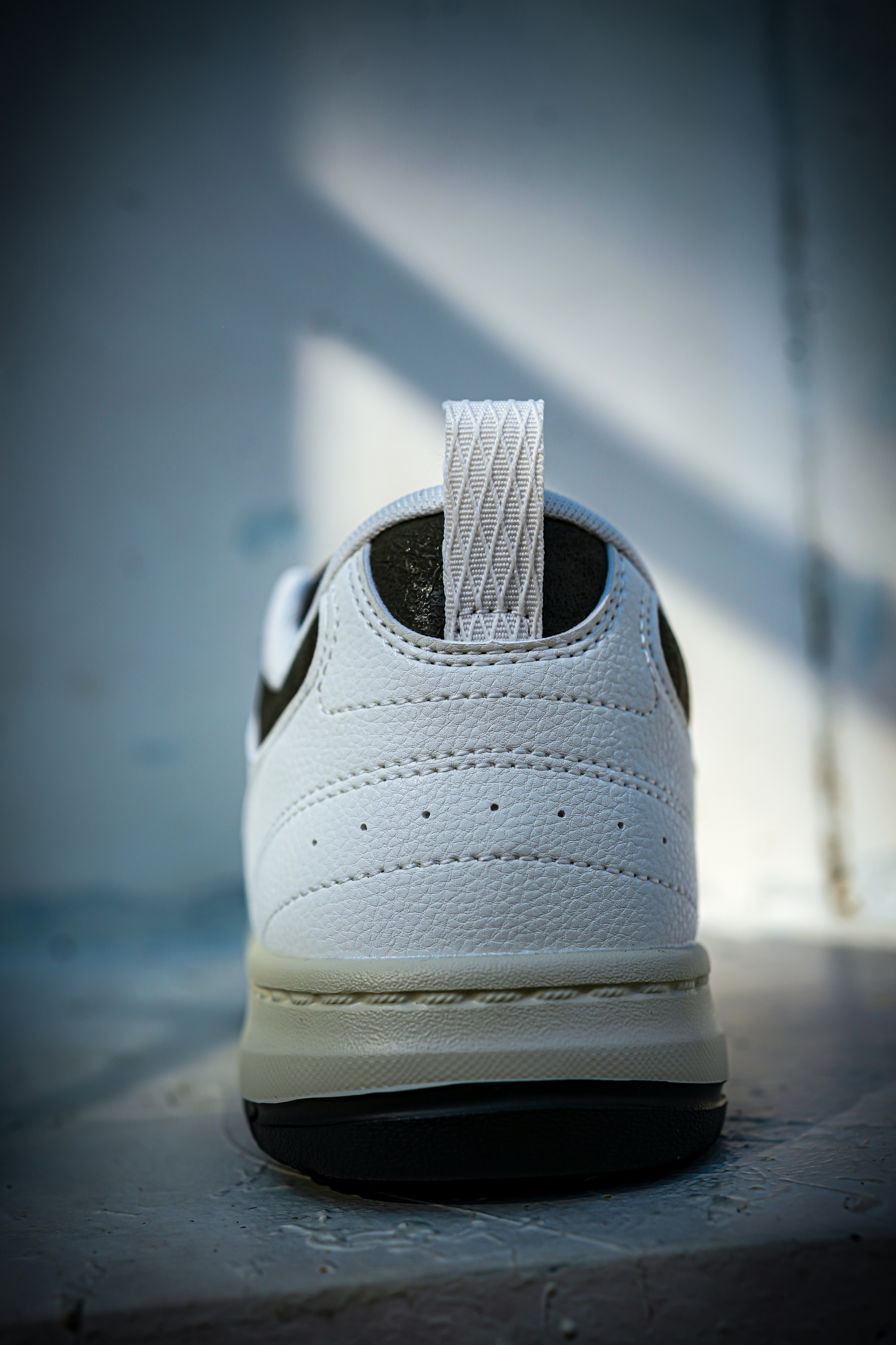 Back-heel Focus: White Sneaker Back View in Soft Light
