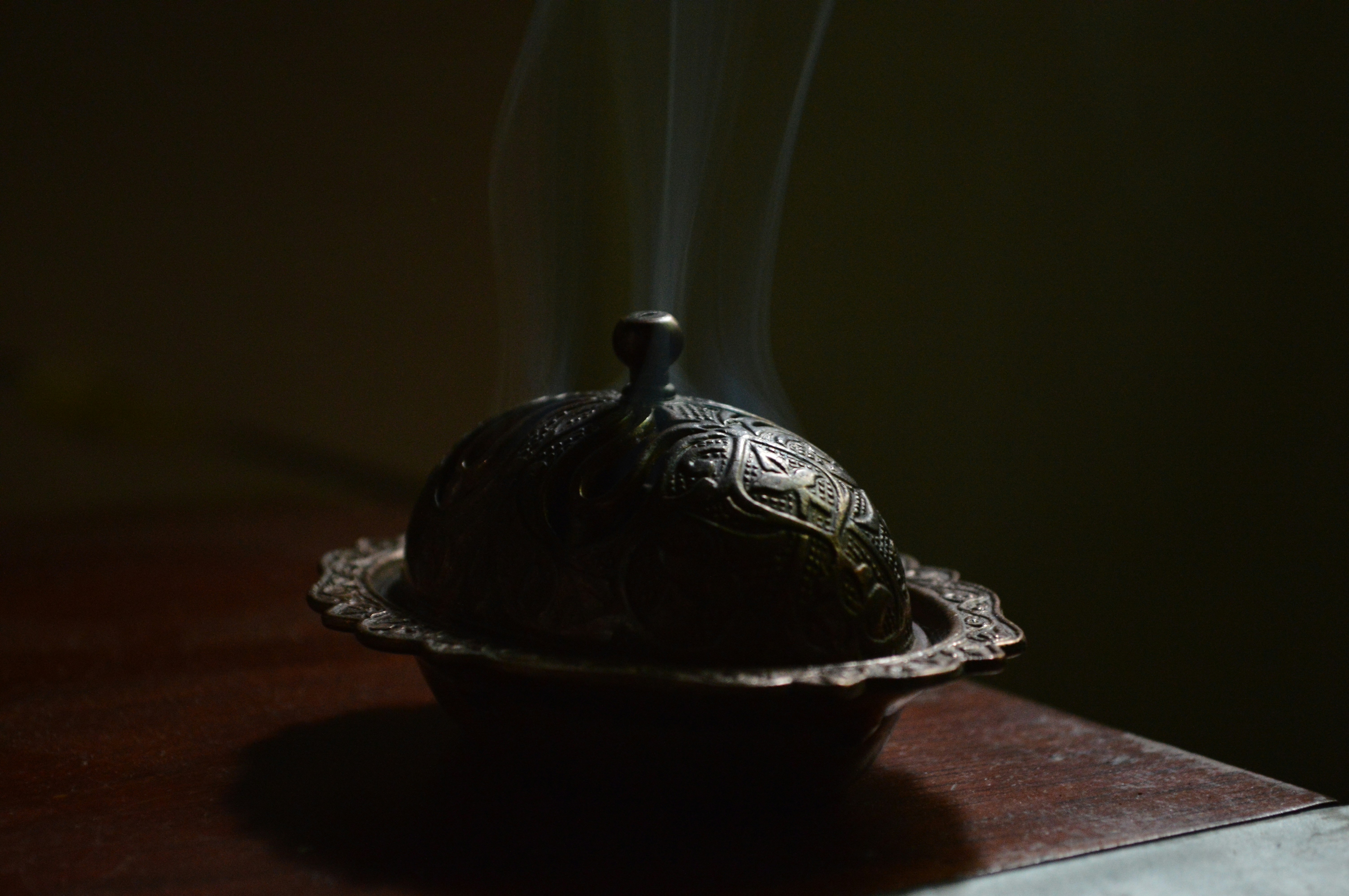 Smoke and Silence: A Small Buddhist Lamp Quietly Emanates Light