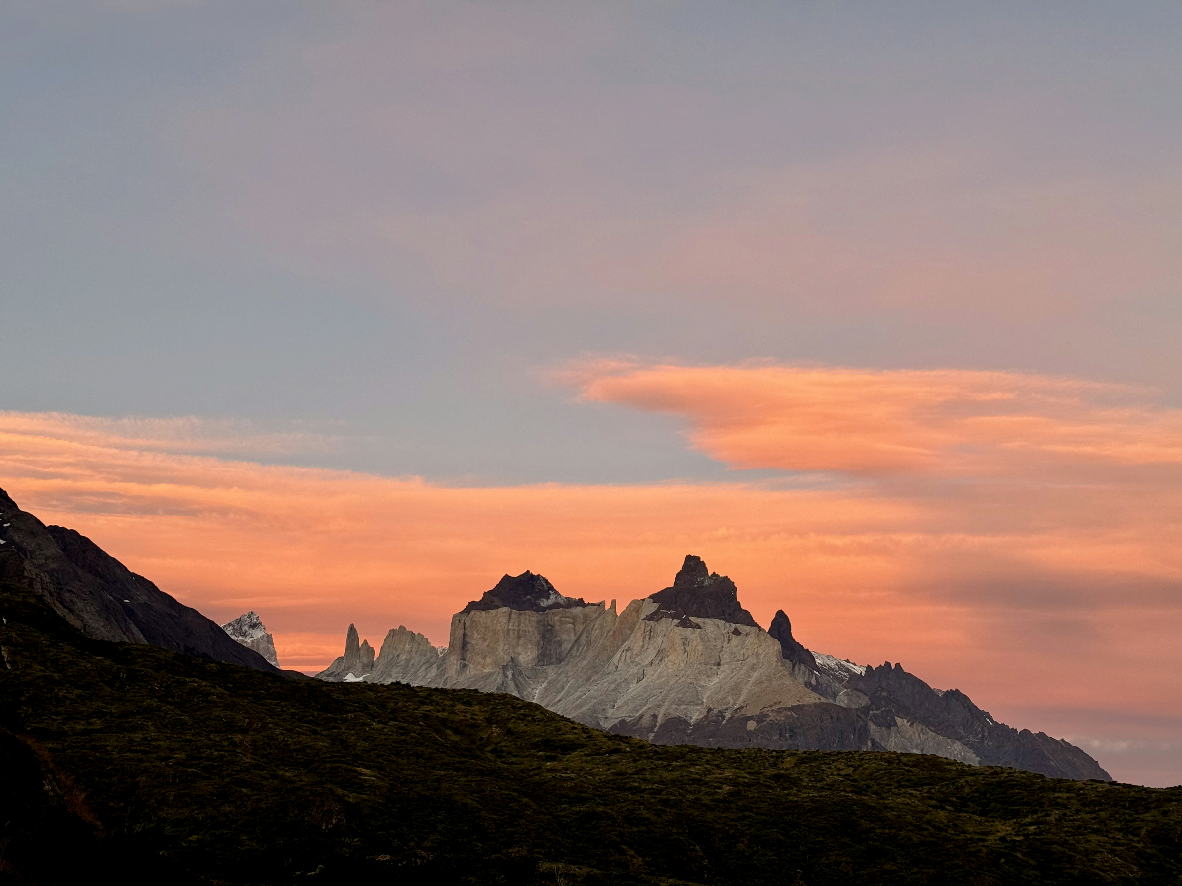 Distant Peaks Beneath a Painted Sunset