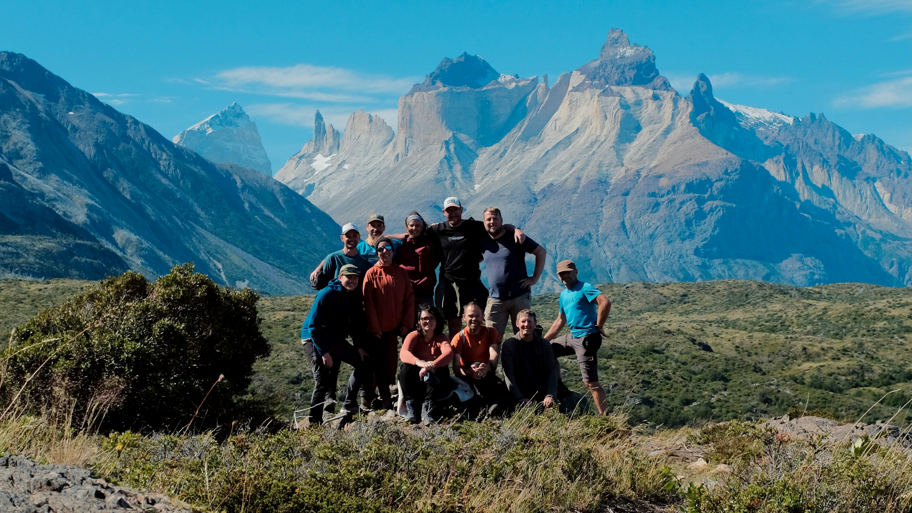 Hikers Conquer the Alpine Ridge under towering Peaks