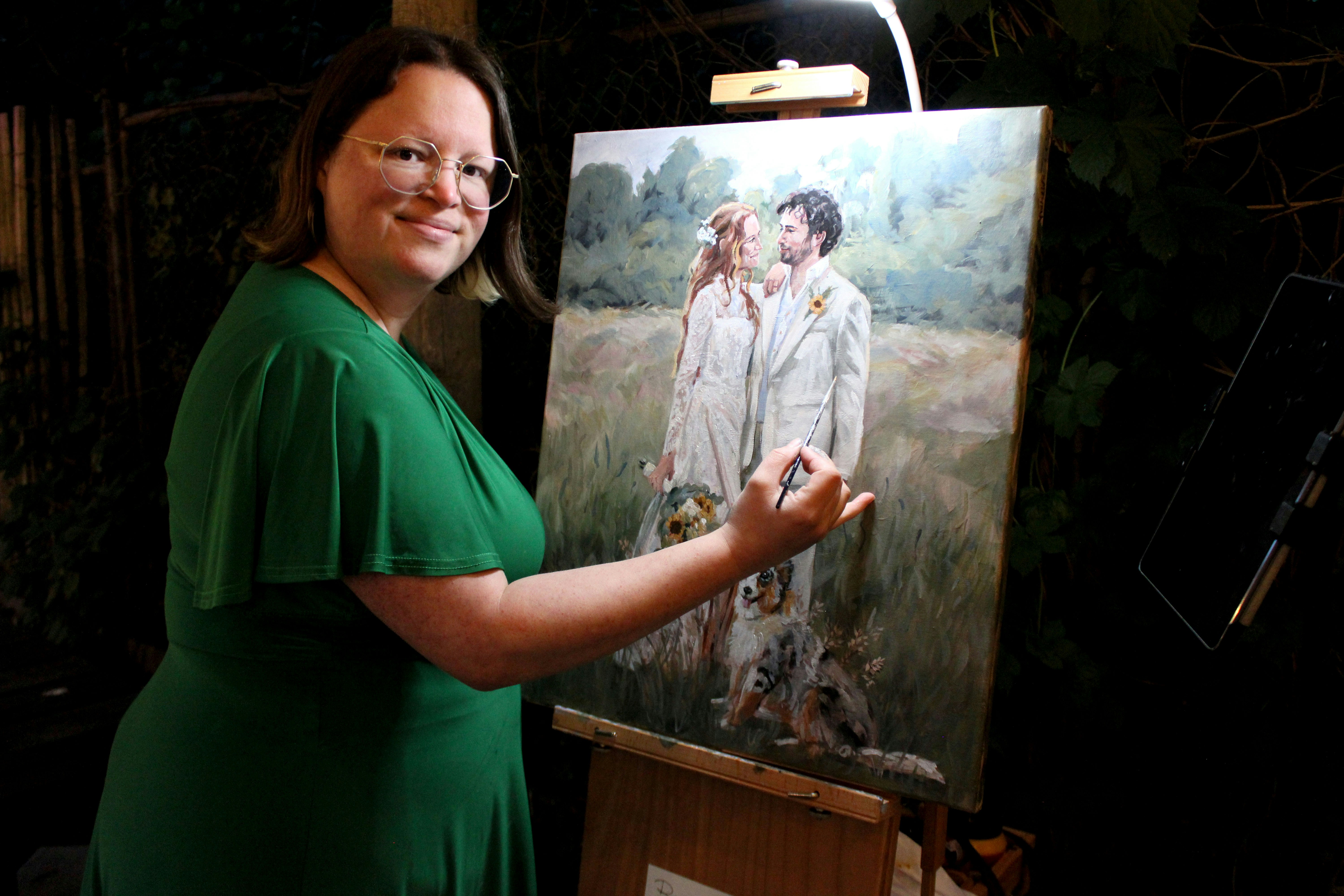 Green-draped Artist at Work: A Portrait Session in Soft Night Light