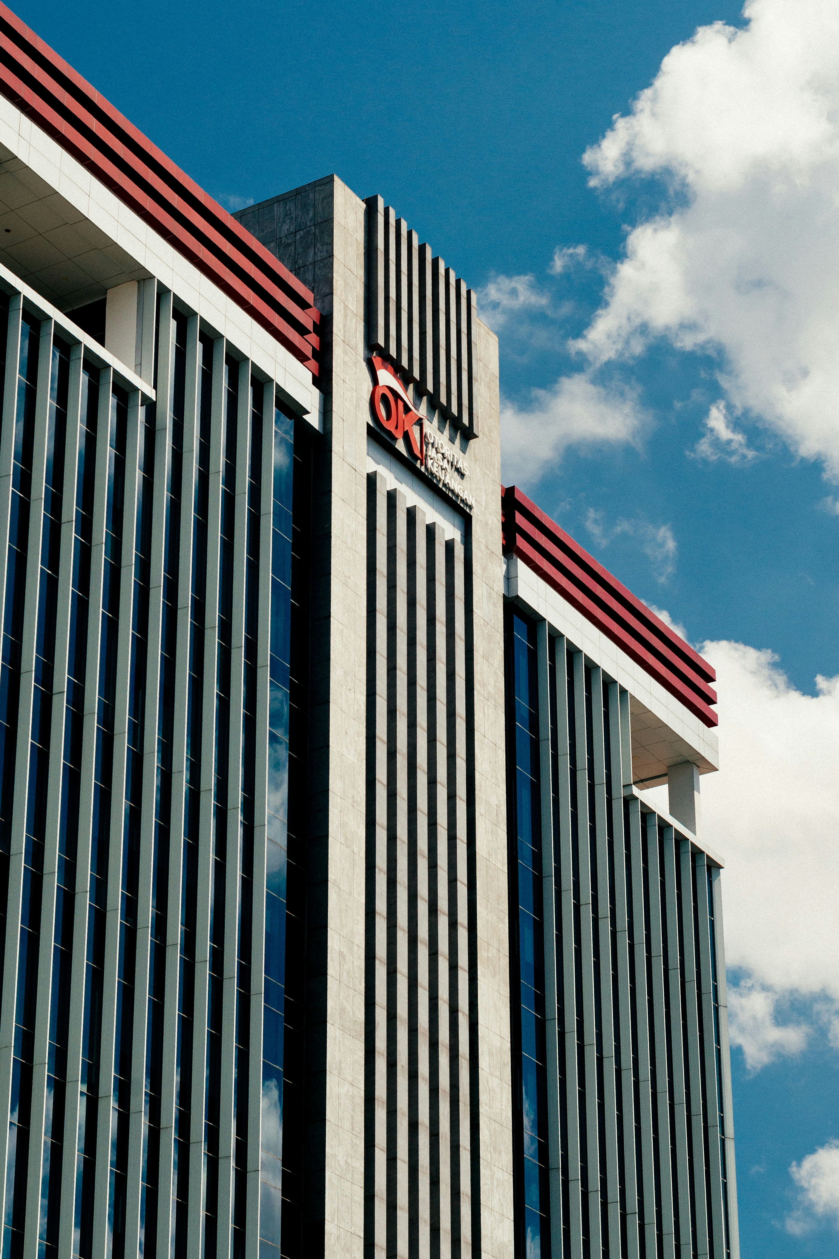 Vertical Corporate Tower Reaching Toward a Blue Sky