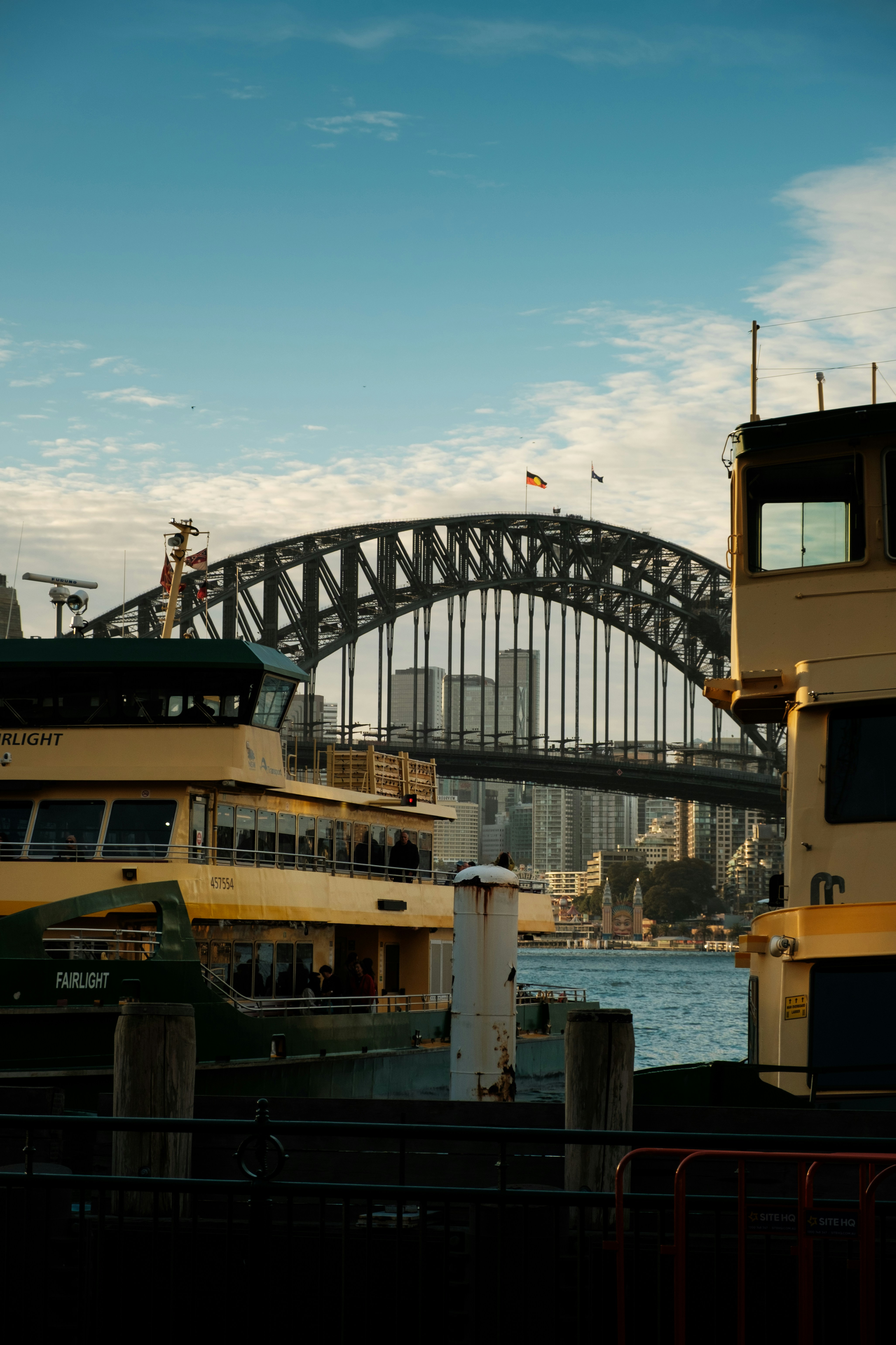 Harbor Light: A Ferry Passes Under the Sydney-Style Arch at Dusk