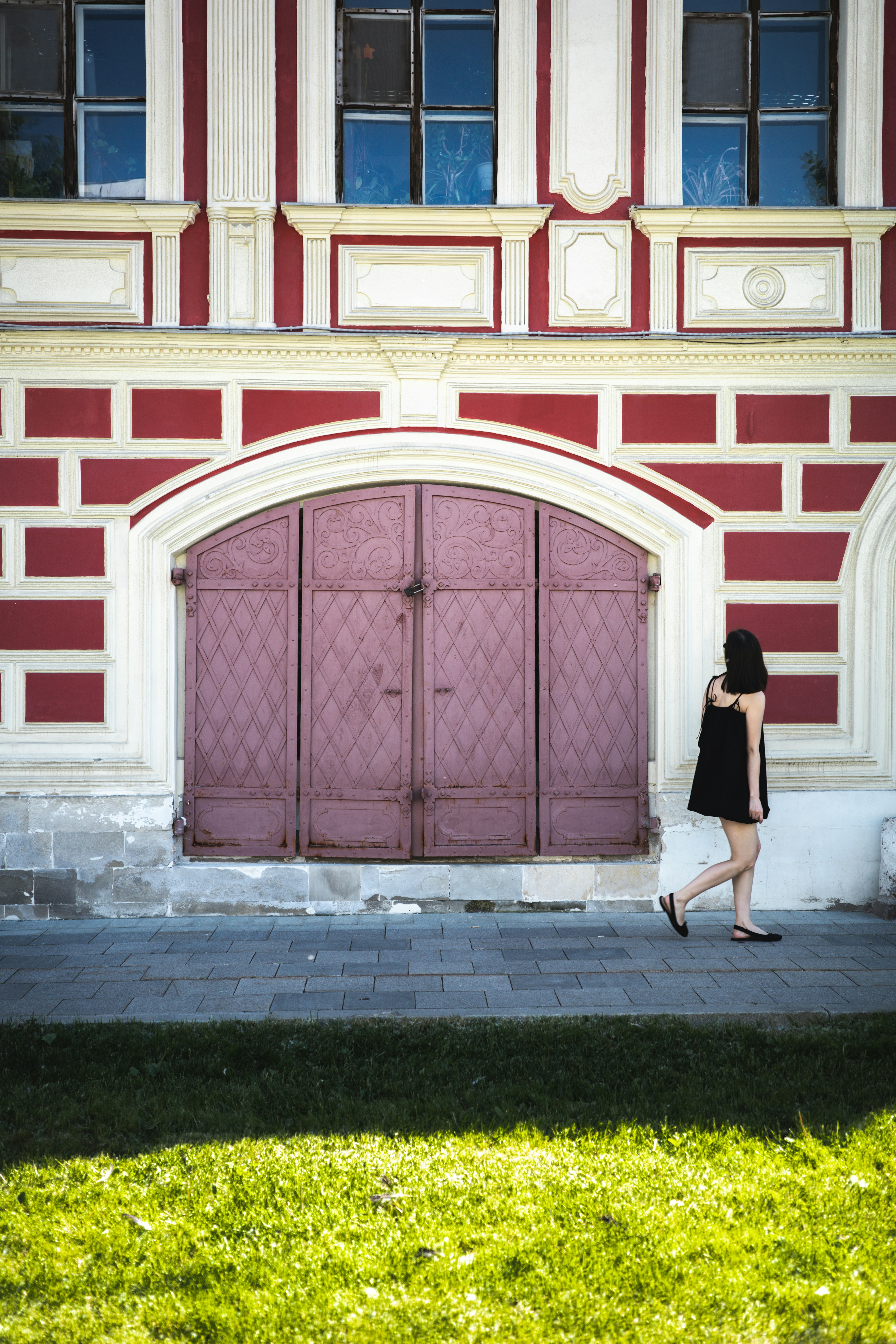 A Quiet Stride by the Crimson Archway