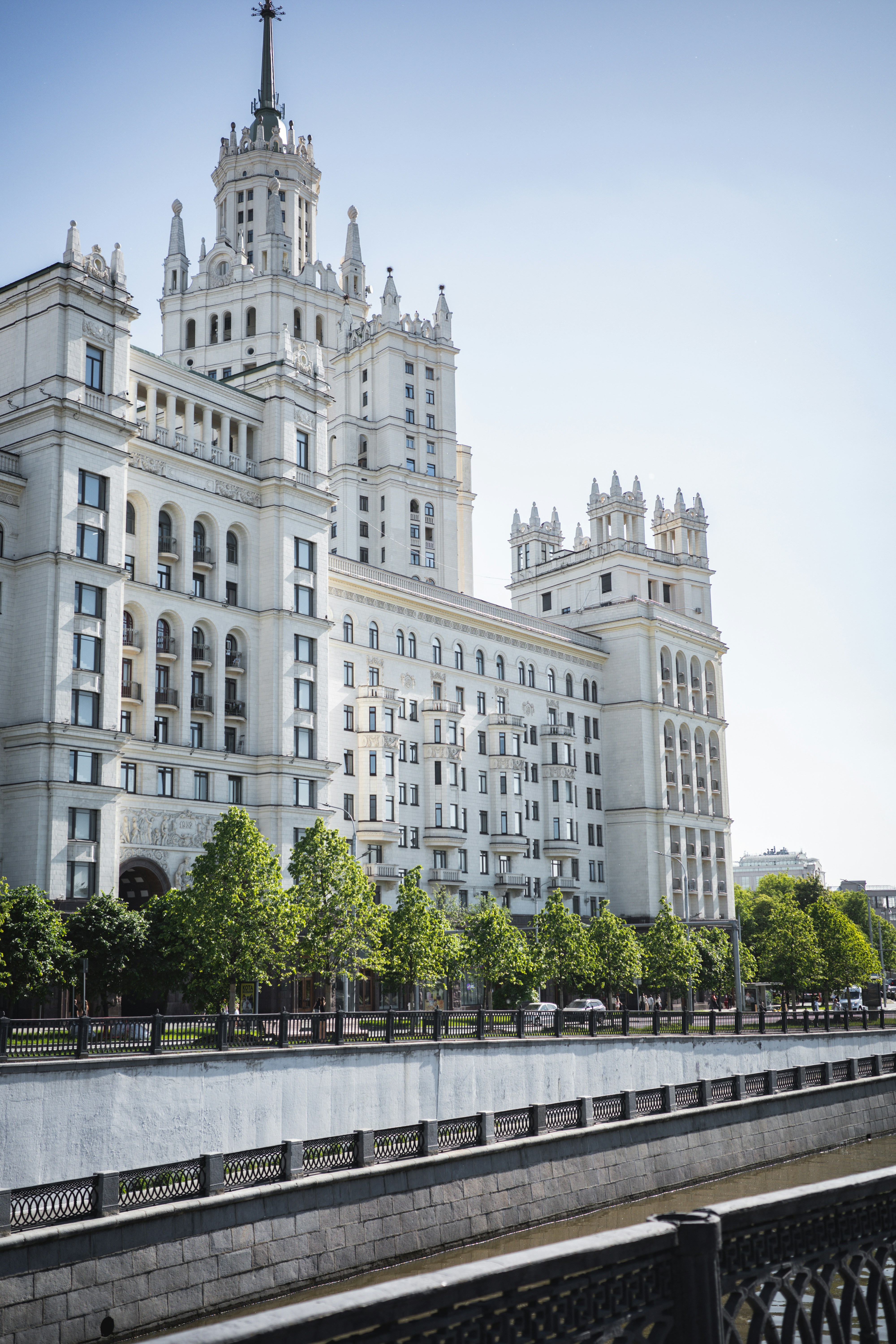 Giant Neoclassical Towering Edifice Along a Tree-Lined Embankment