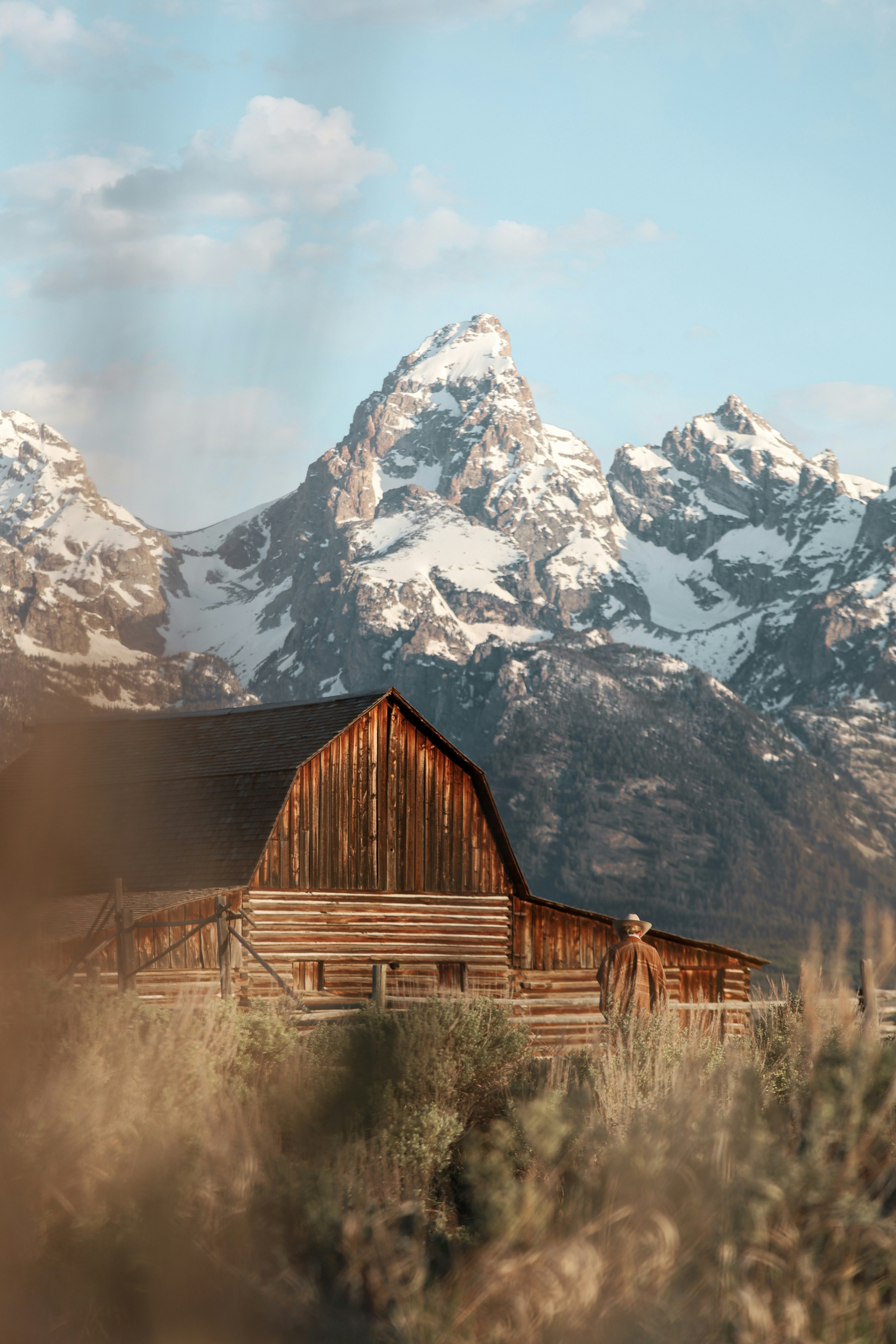 Snowy Peaks Behind Weathered Barn