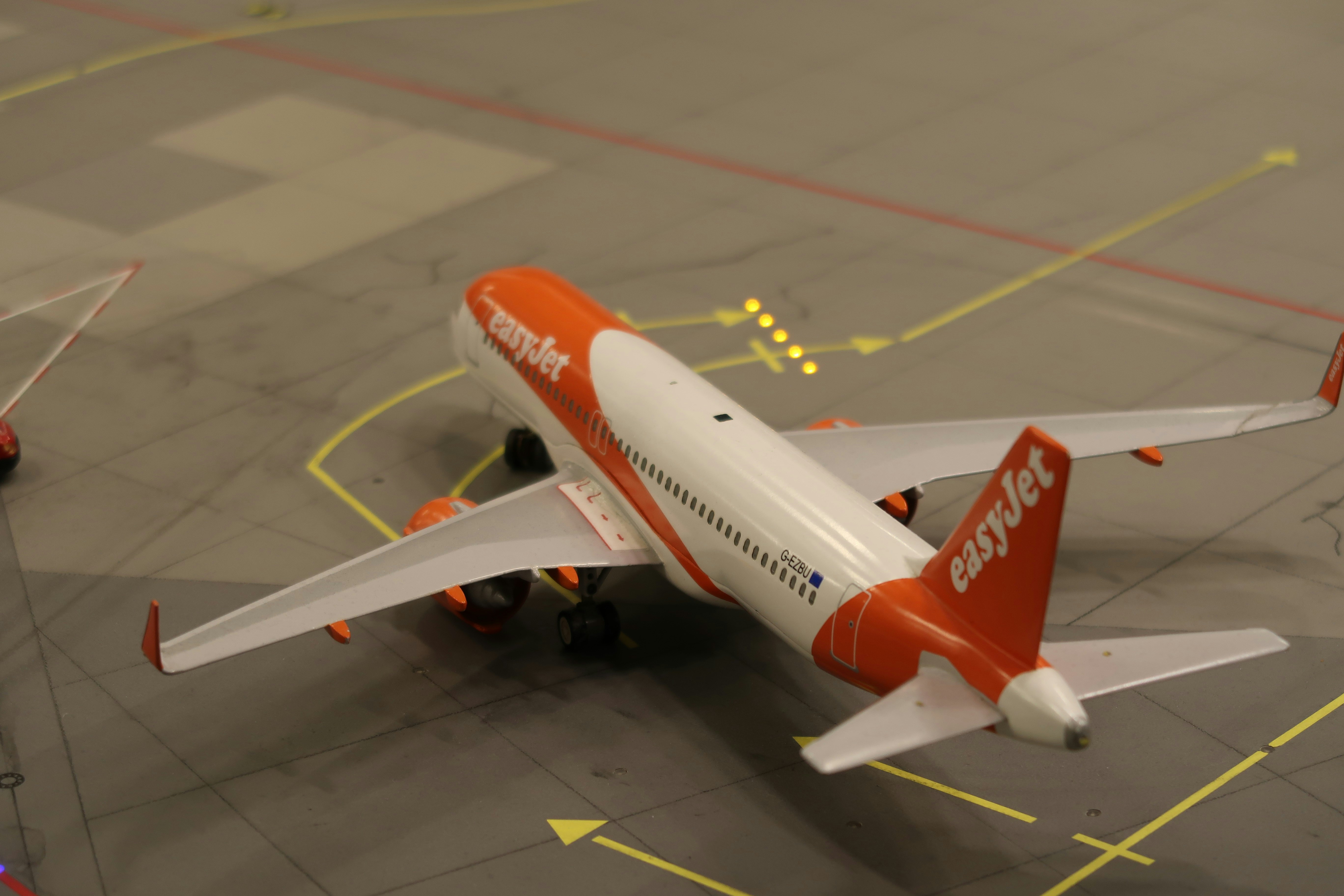 EasyJet Jet at Gate: A Scale Model in a Realistic Airline Port