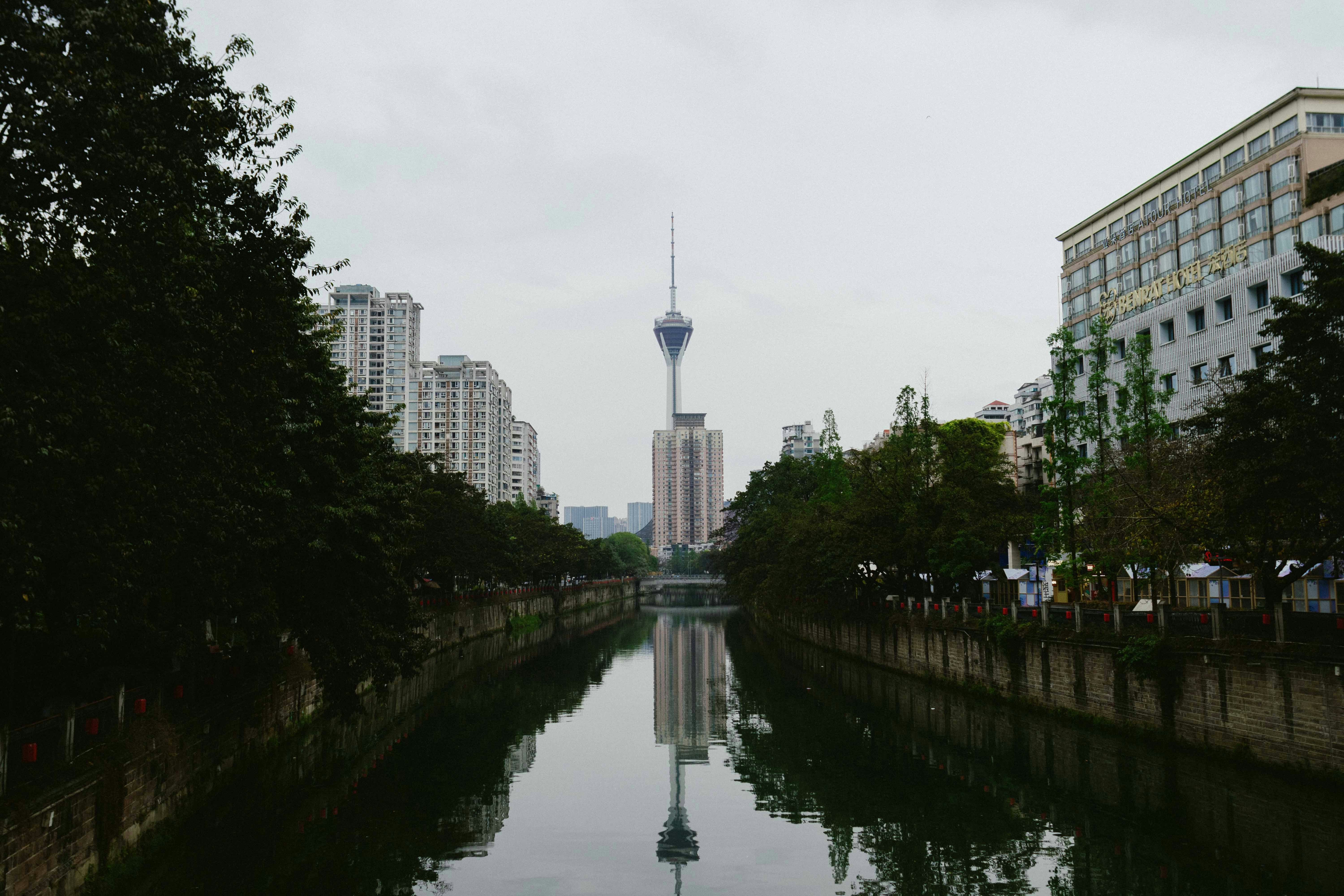 Twin Towers Over a Reflective Waterway